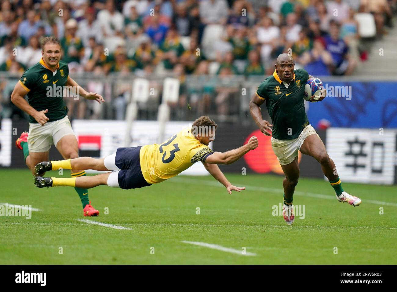 South Africa's Makazole Mapimpi (right) gets away from Romania's ...