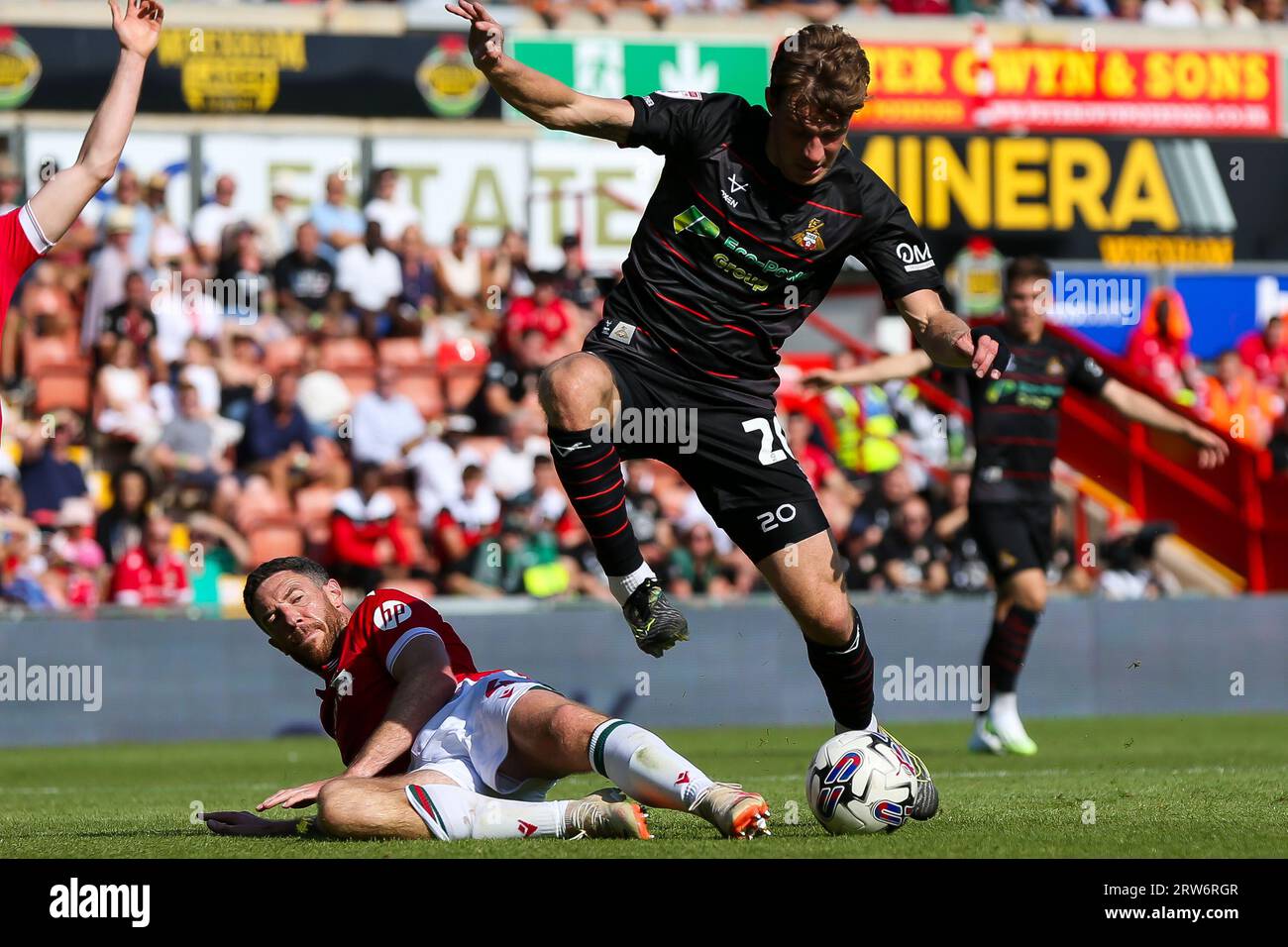Wrexham's Ben Tozer and Doncaster Rovers' Joe Ironside battle for the ...