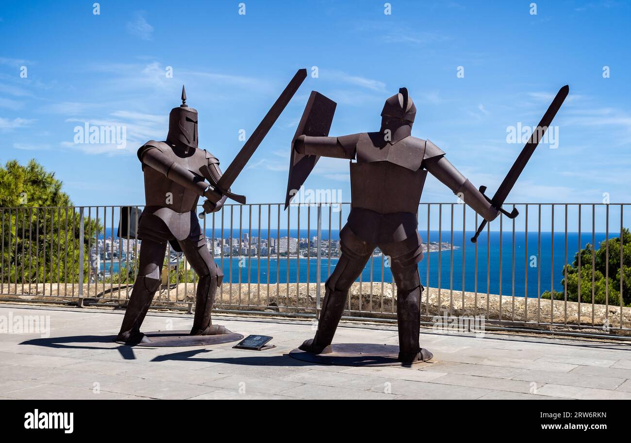 Pair of iron knights jousting on ramparts of Santa Barbara Castle in ...