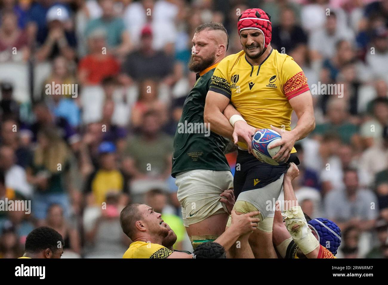 Romania's Adrian Motoc, right, and South Africa's Rg Snyman fight for ...