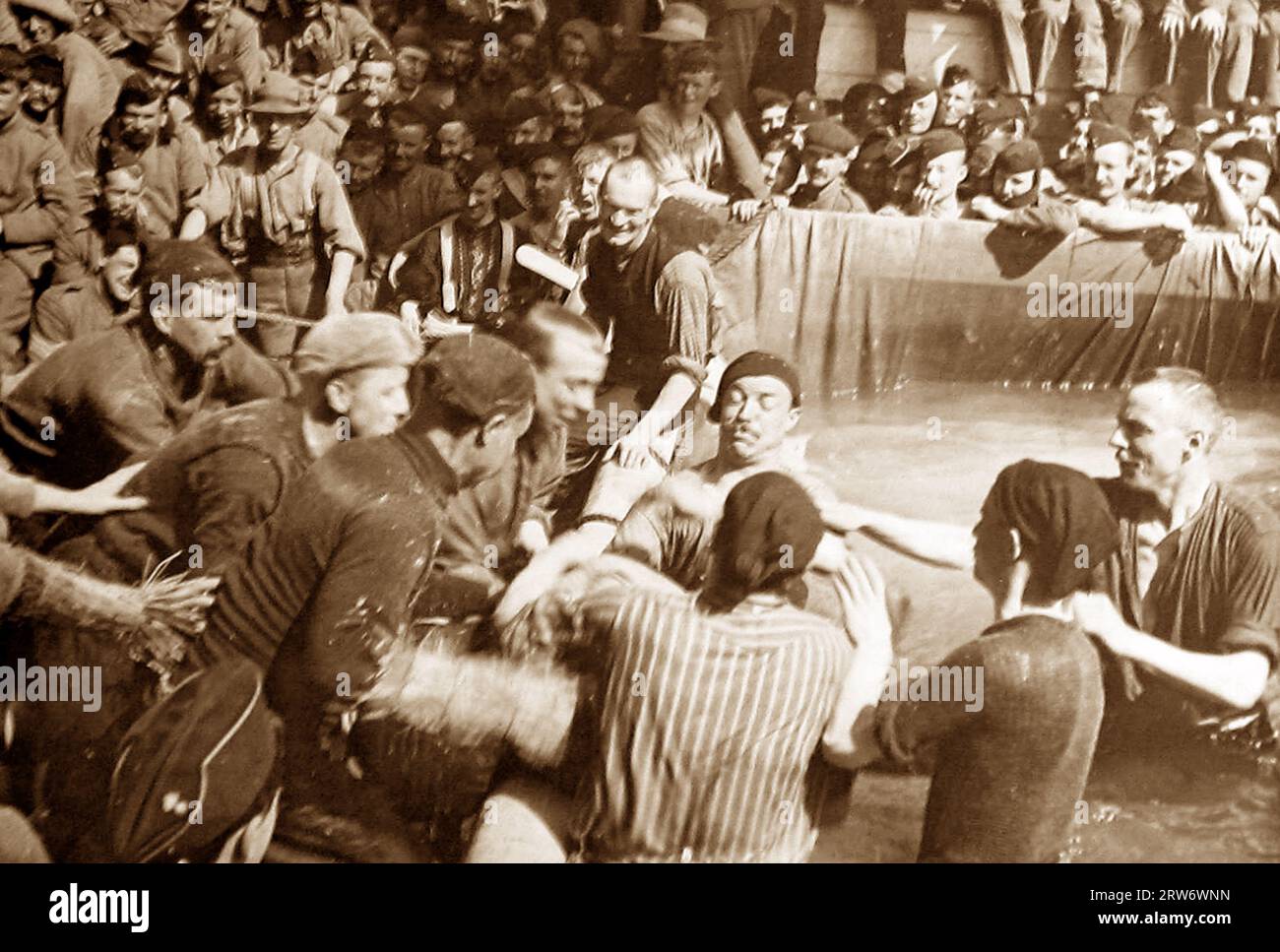 Troop ship 'crossing the line' ceremony, early 1900s Stock Photo - Alamy