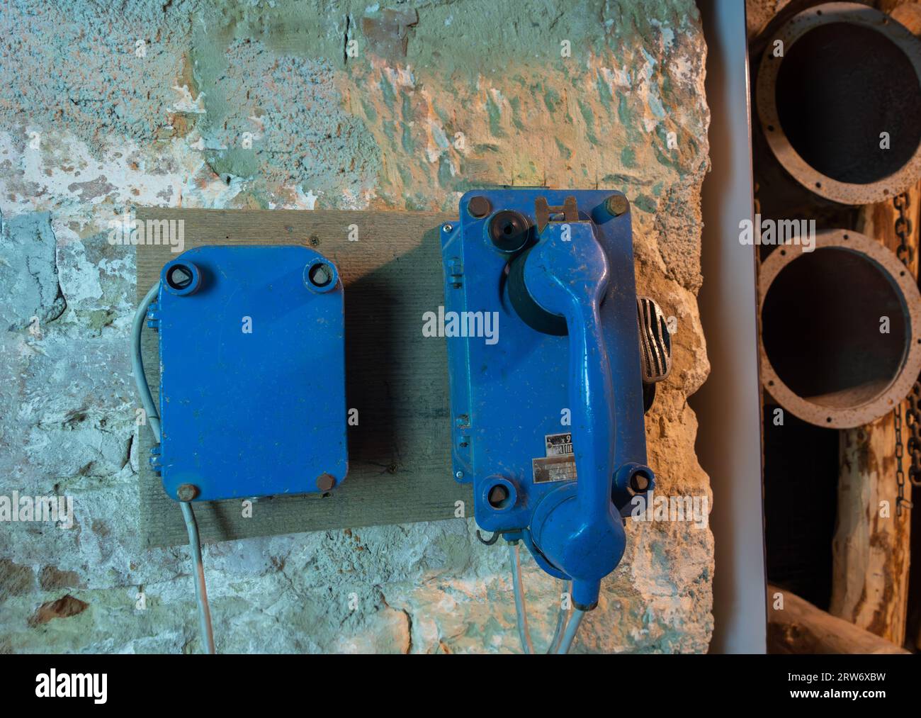 A mine phone installed on a wall in a deep mine Stock Photo - Alamy