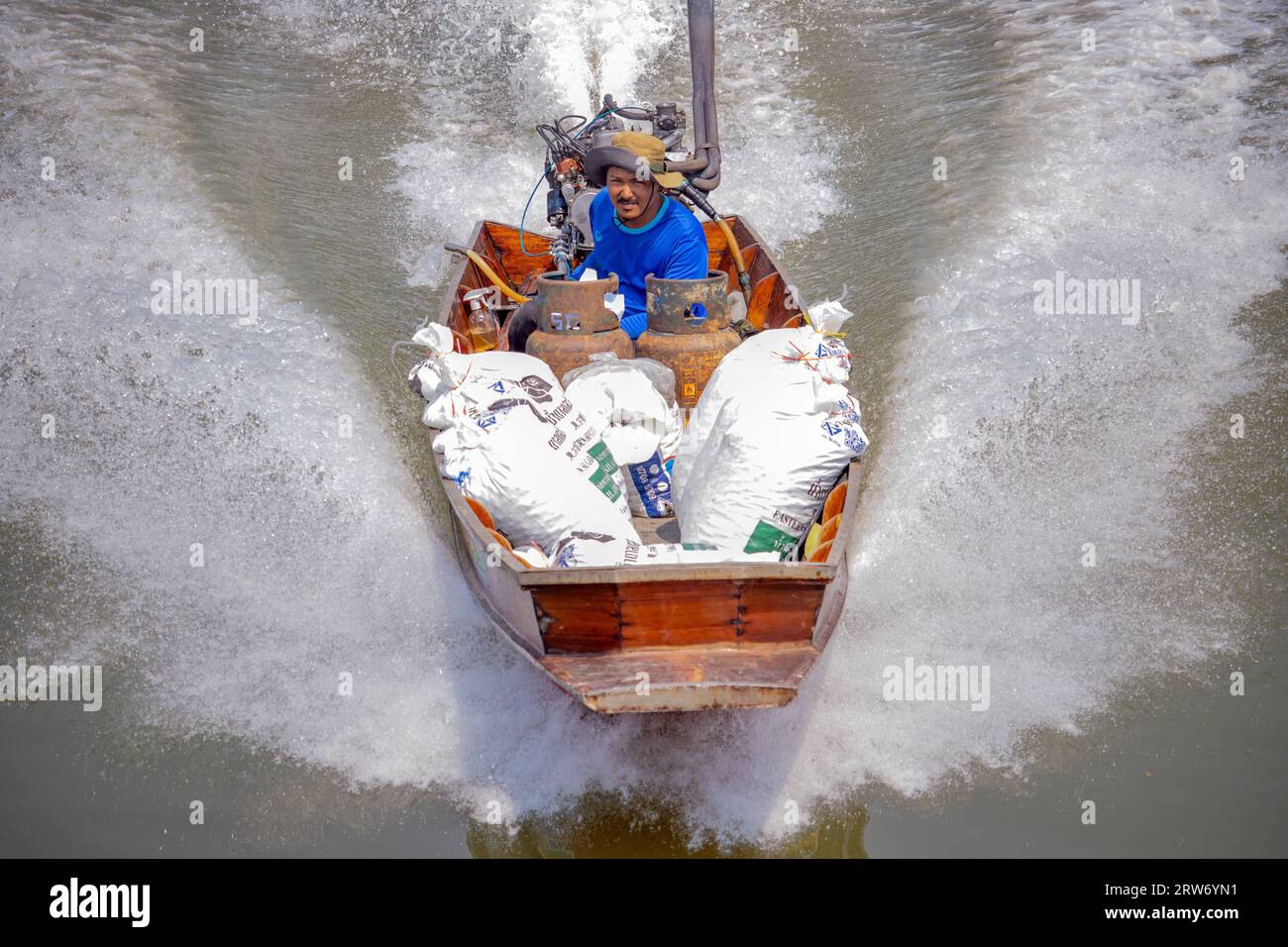 BANGKOK, THAILAND, FEB 23 2023, Transportation of full sacks on a boat ...