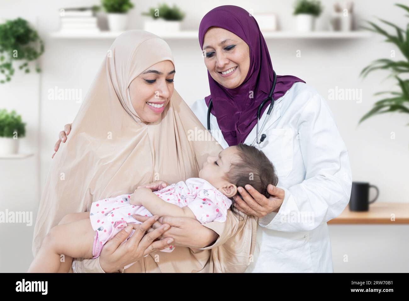 Happy Young arab mother wearing with her cute little baby visiting ...