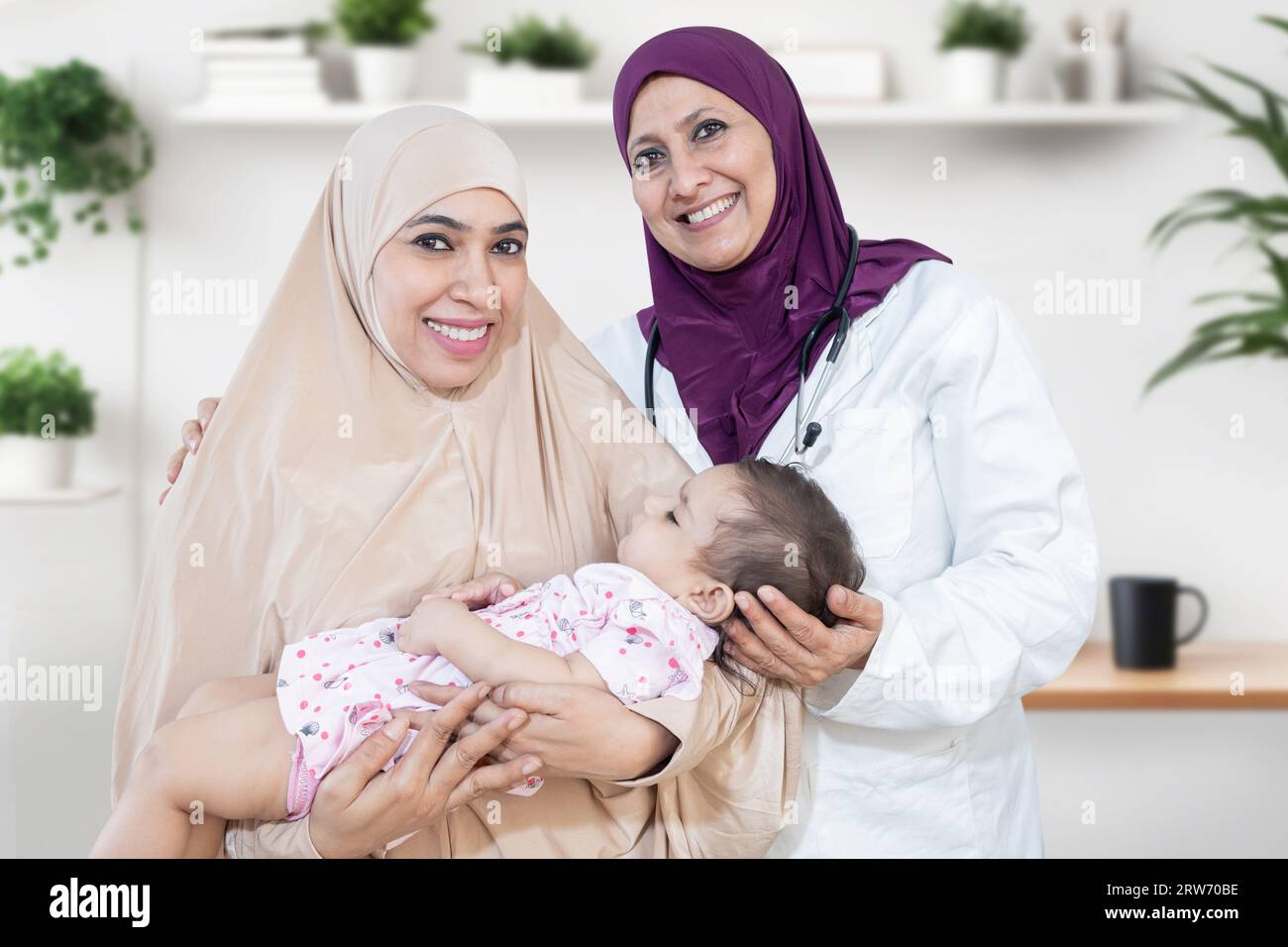 Portrait of Happy Young arab mother wearing with her cute little baby ...