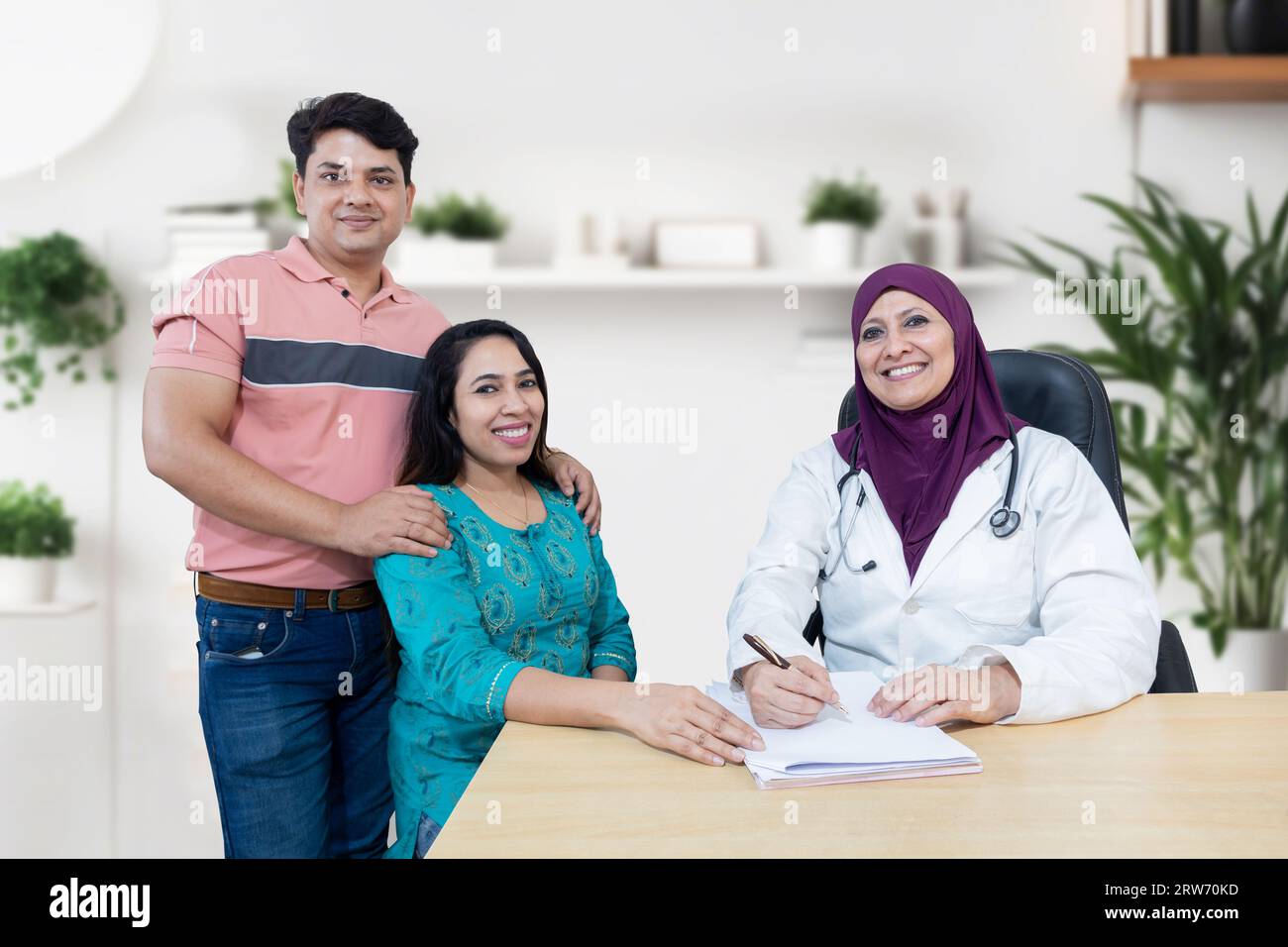 Portrait of Indian female muslim doctor wearing head scarf consulting ...