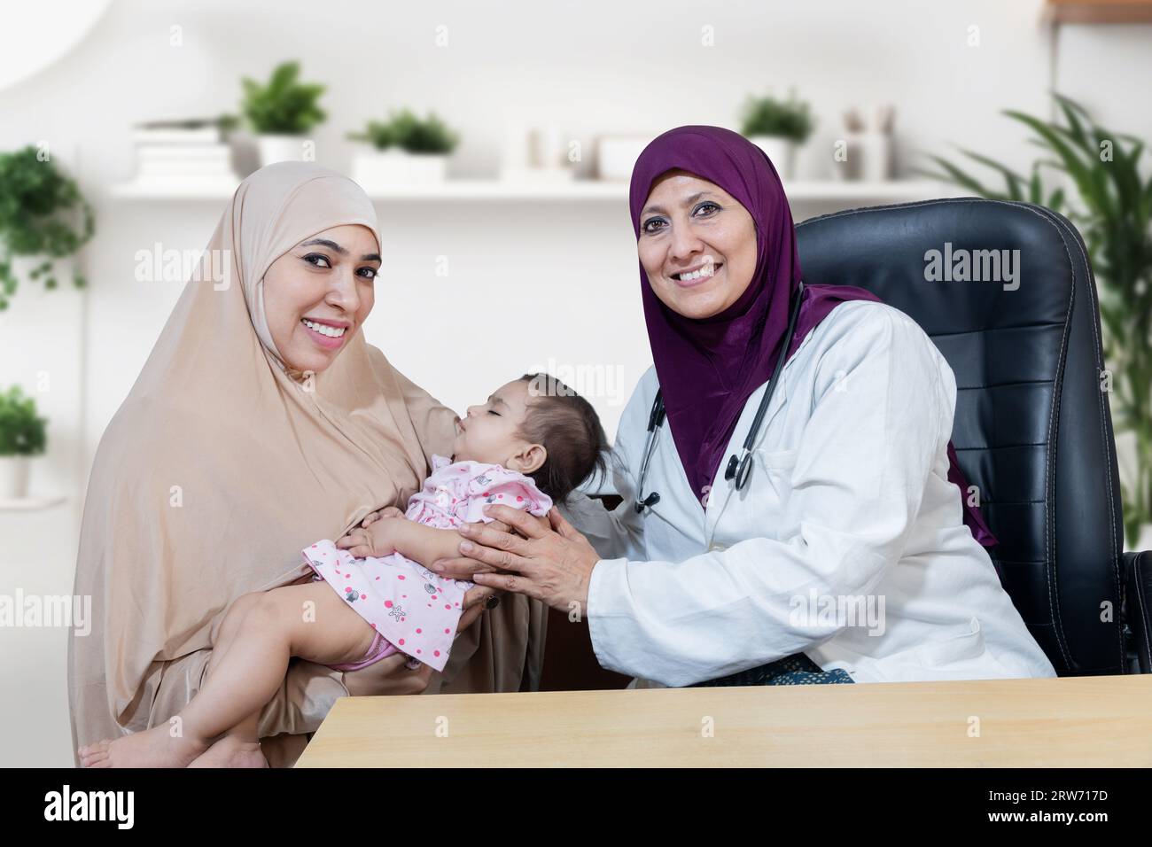 Happy Young arab mother wearing with her cute little baby visiting ...