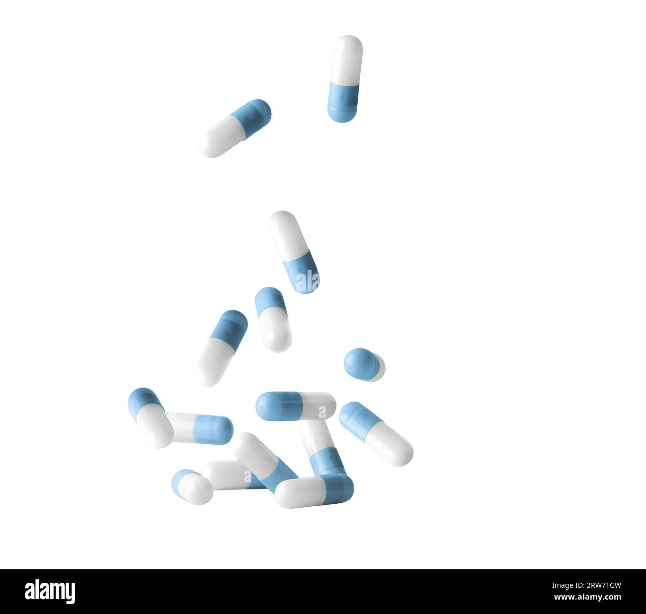 Falling blue white capsules on white background Stock Photo - Alamy