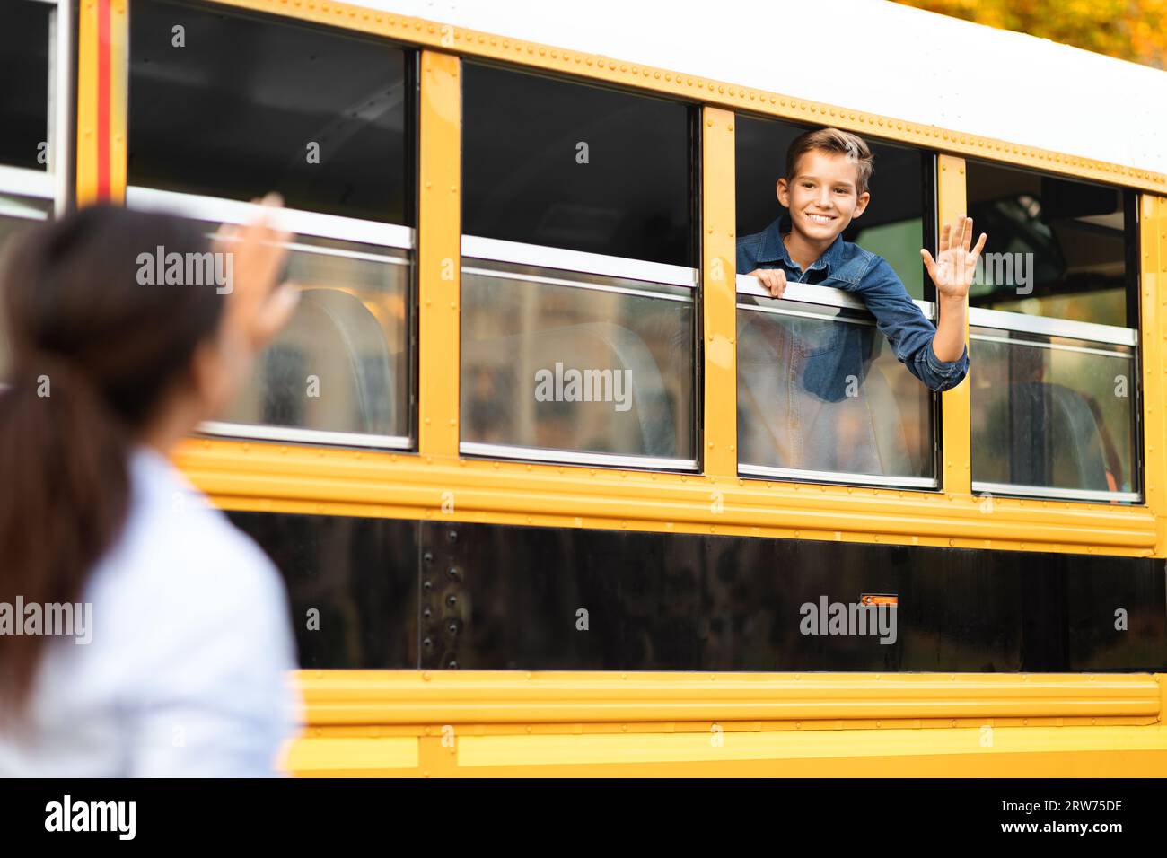 Boy waving mother bus hi-res stock photography and images - Alamy