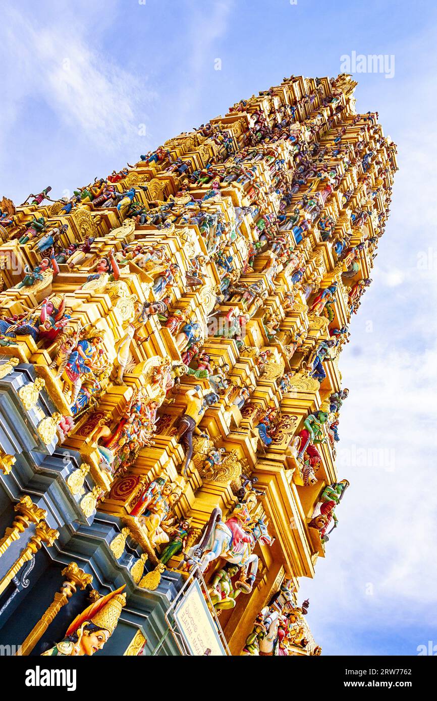 Many painted figures of gods on Gopura of Sri Muthumariamman Temple in ...