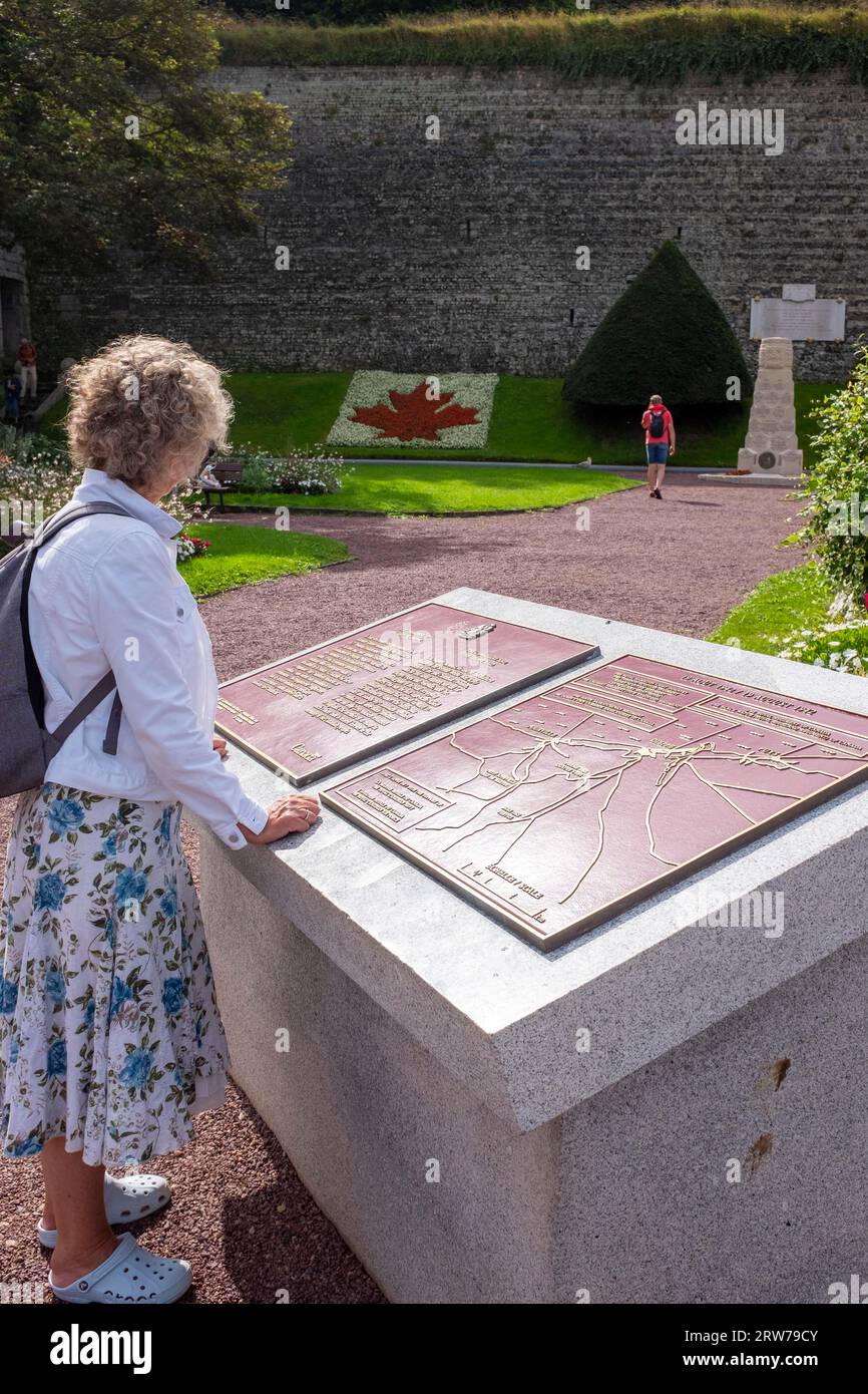 A visitor looks at the information at the memorial gardens to Canadian ...