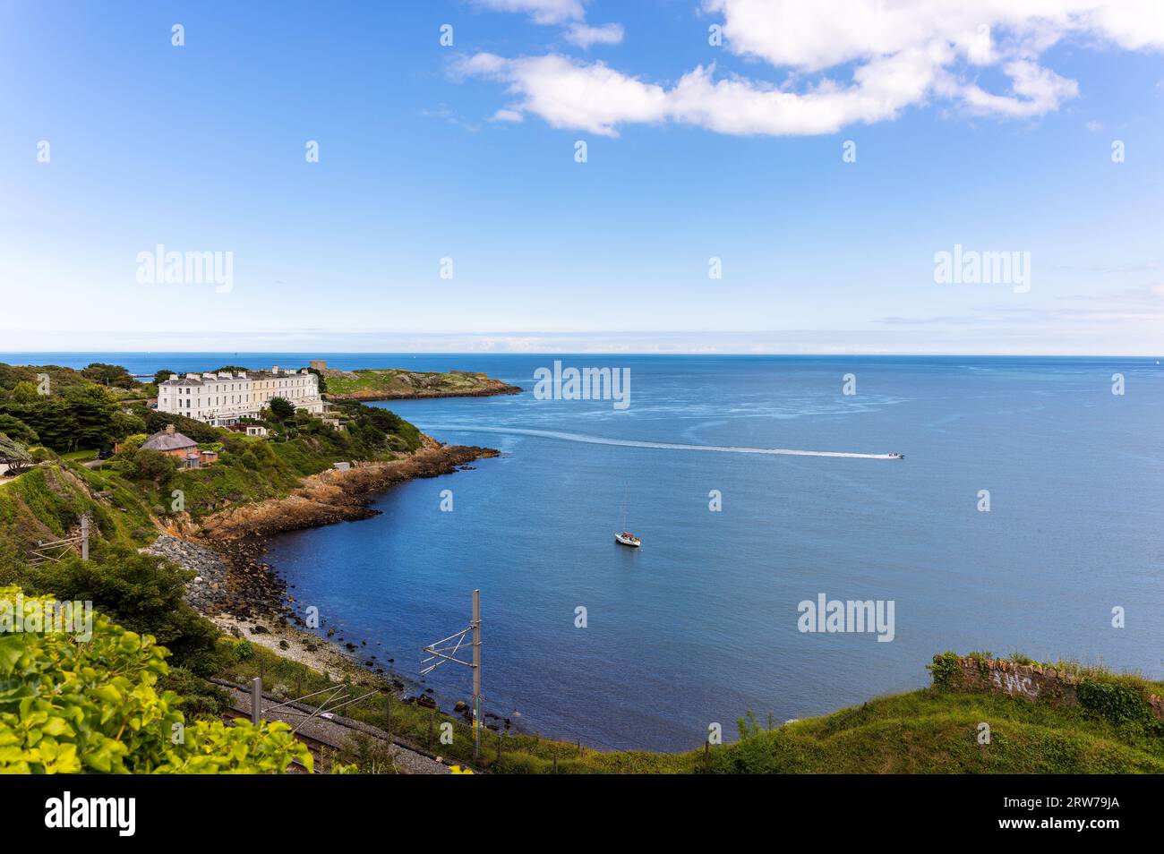 View of Killiney Bay on sunny summer day along coast. Luxury homes at ...