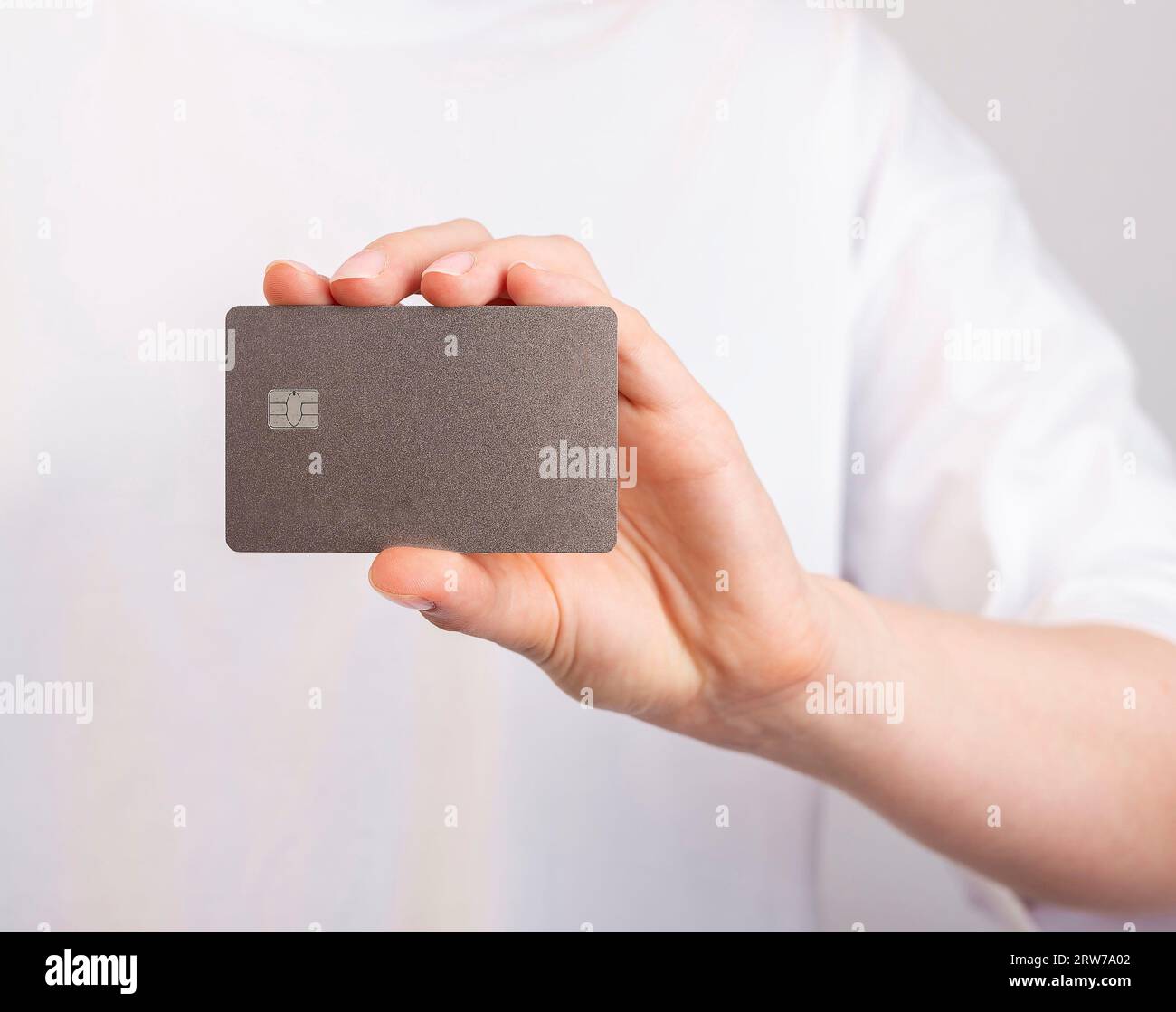 Hand holding bank card mockup, bankcard with chip Stock Photo - Alamy