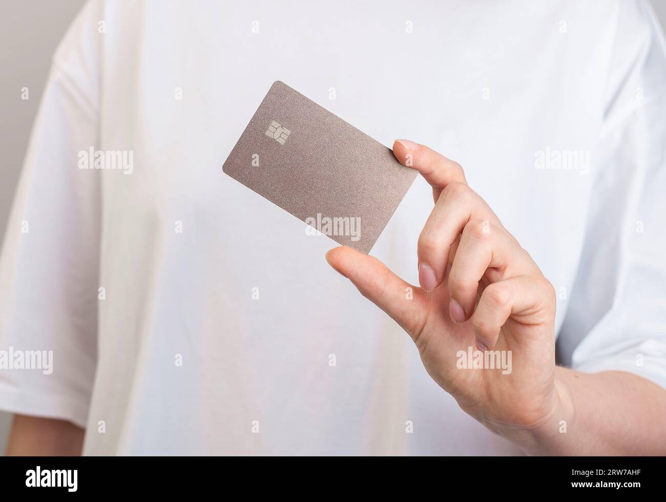 Plastic bank card mockup in hand Stock Photo - Alamy