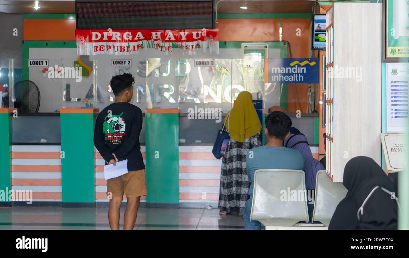 Pinrang Indonesia, 14 September 2023: Several residents are sitting waiting for the registration ...