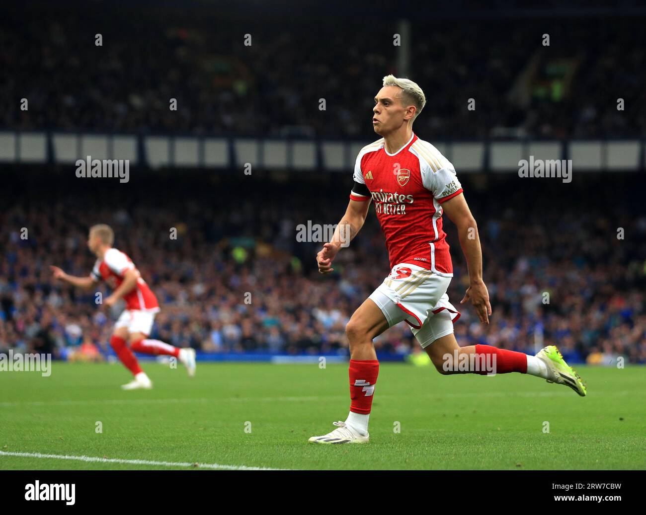 Arsenal's Leandro Trossard (right) celebrates scoring their side's ...