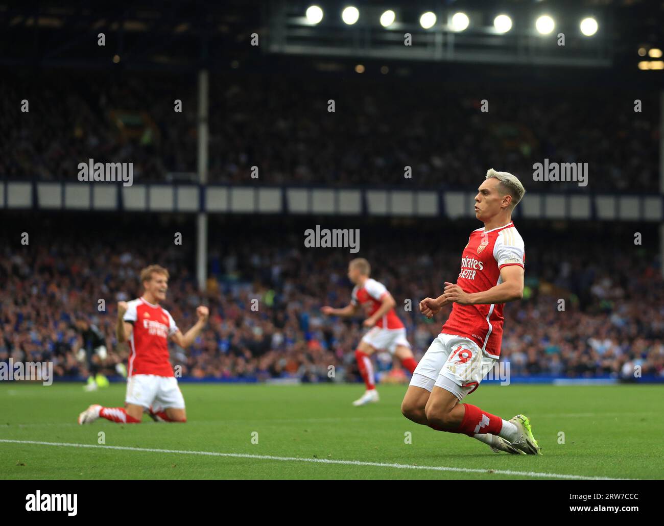 Arsenal's Leandro Trossard (right) celebrates scoring their side's ...