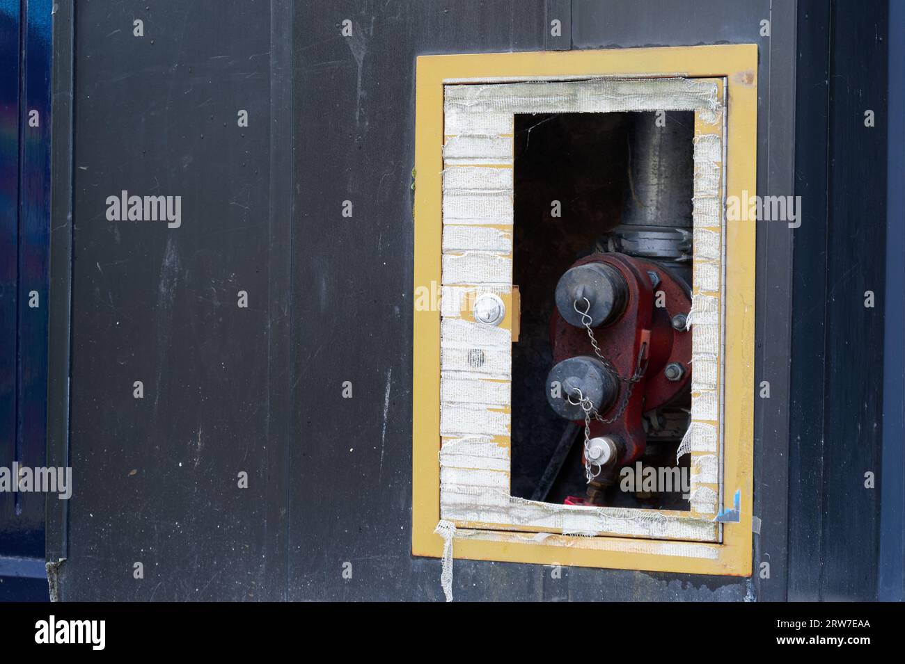 Dry riser red inlet box and sign at wall Stock Photo - Alamy