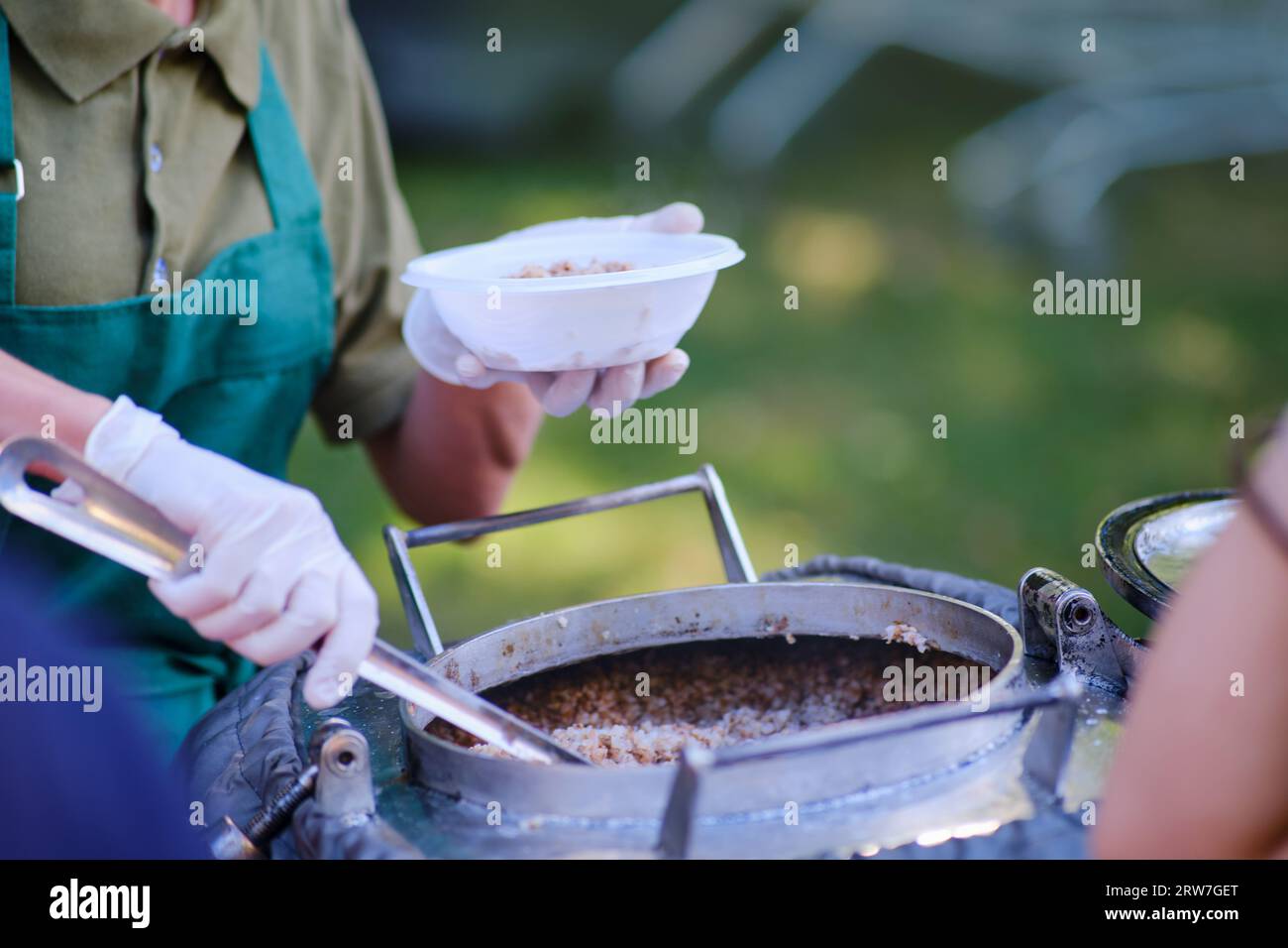 Cooking food in a camping tent. Field kitchen in the park Stock Photo ...