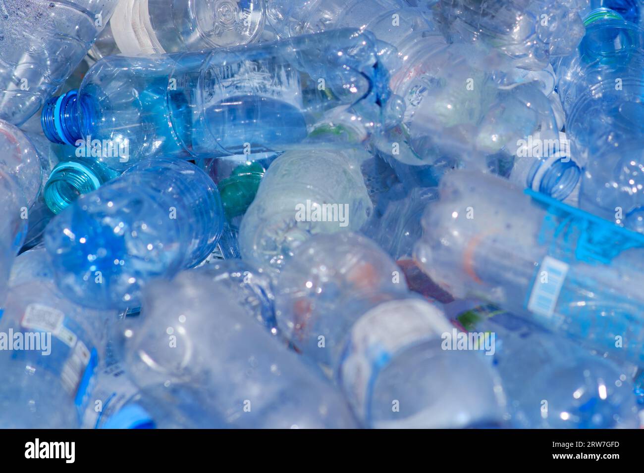 Plastic bottles in the supermarket. Plastic waste. Pollution concept ...