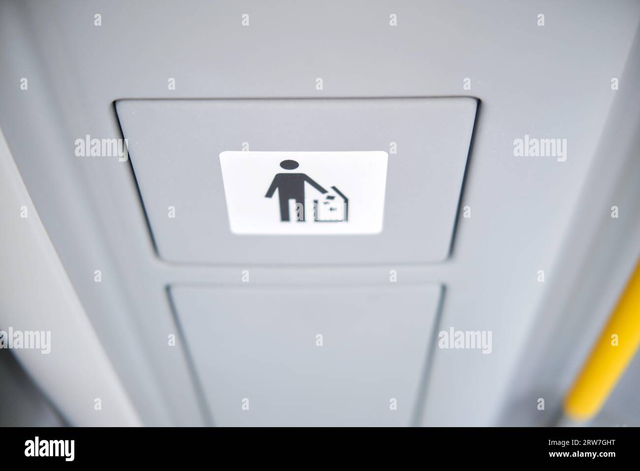 Interior with trash bin for waste in public transport Stock Photo - Alamy