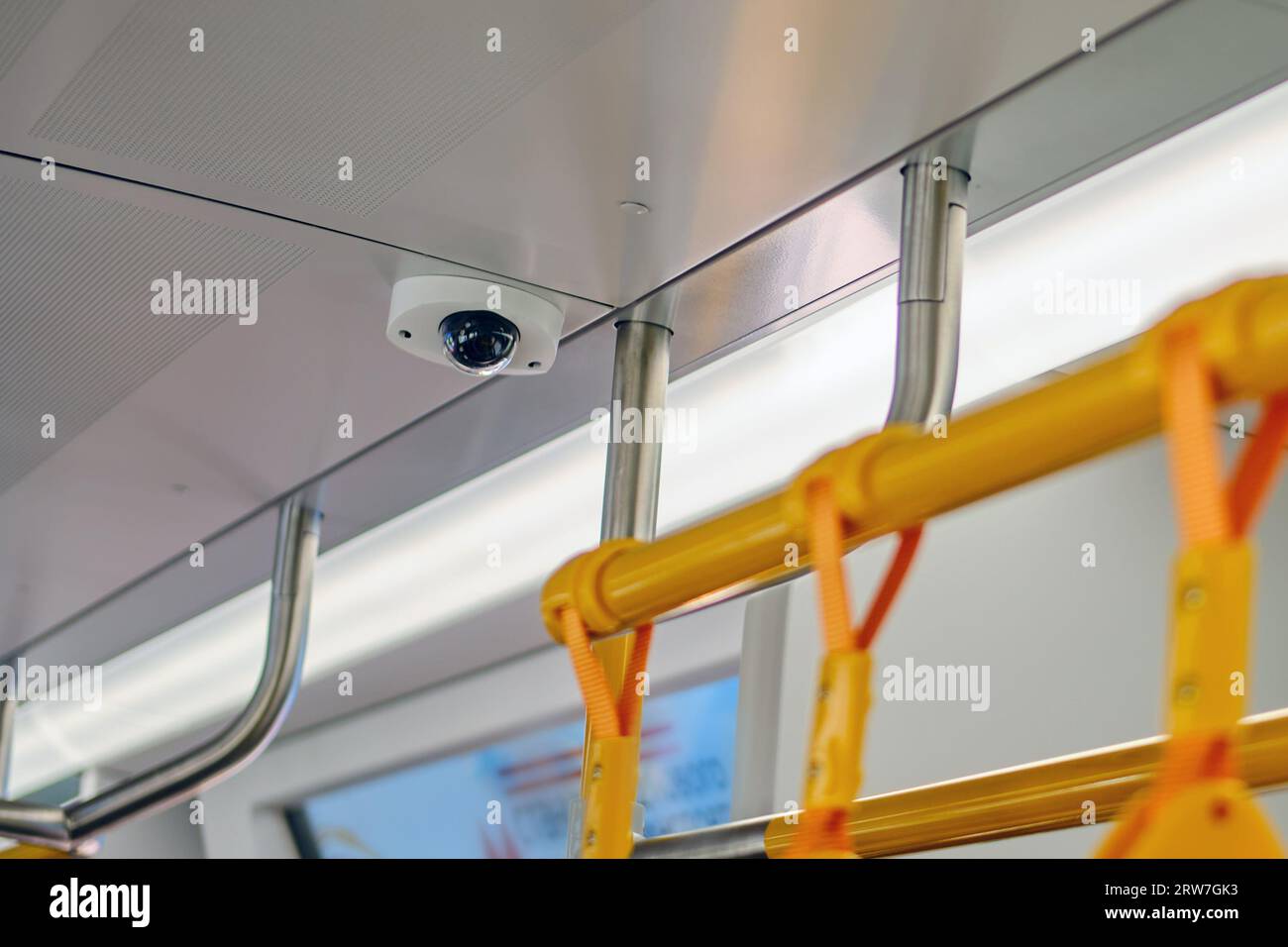 Interior of a train with security camera in the passenger compartment ...