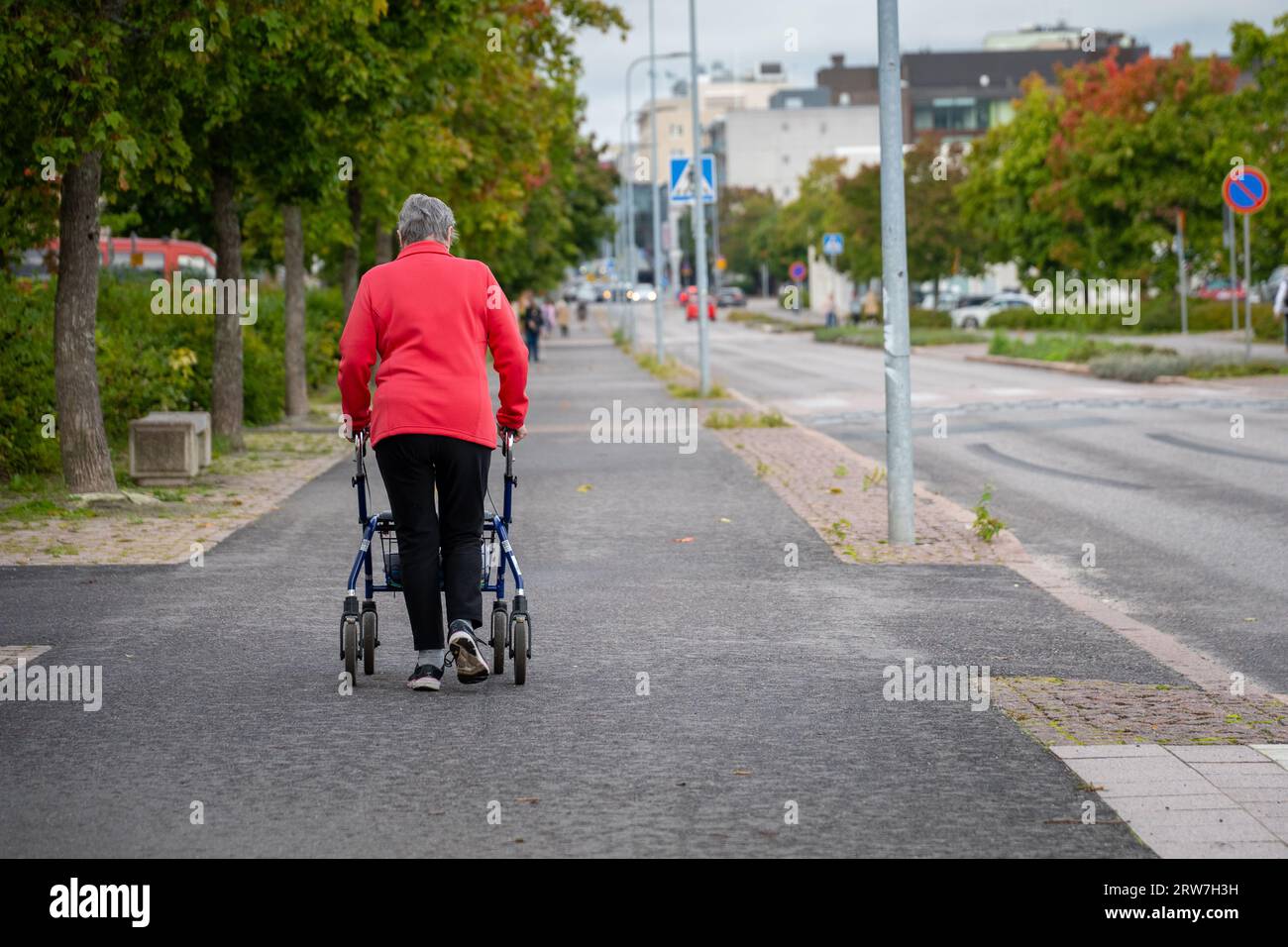 Elderly disabled woman using rollator hi-res stock photography and ...