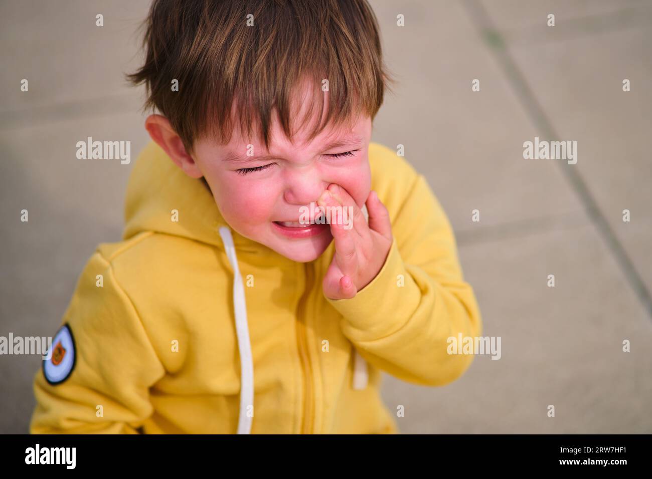 The little baby is crying and expressing his emotions while walking in ...