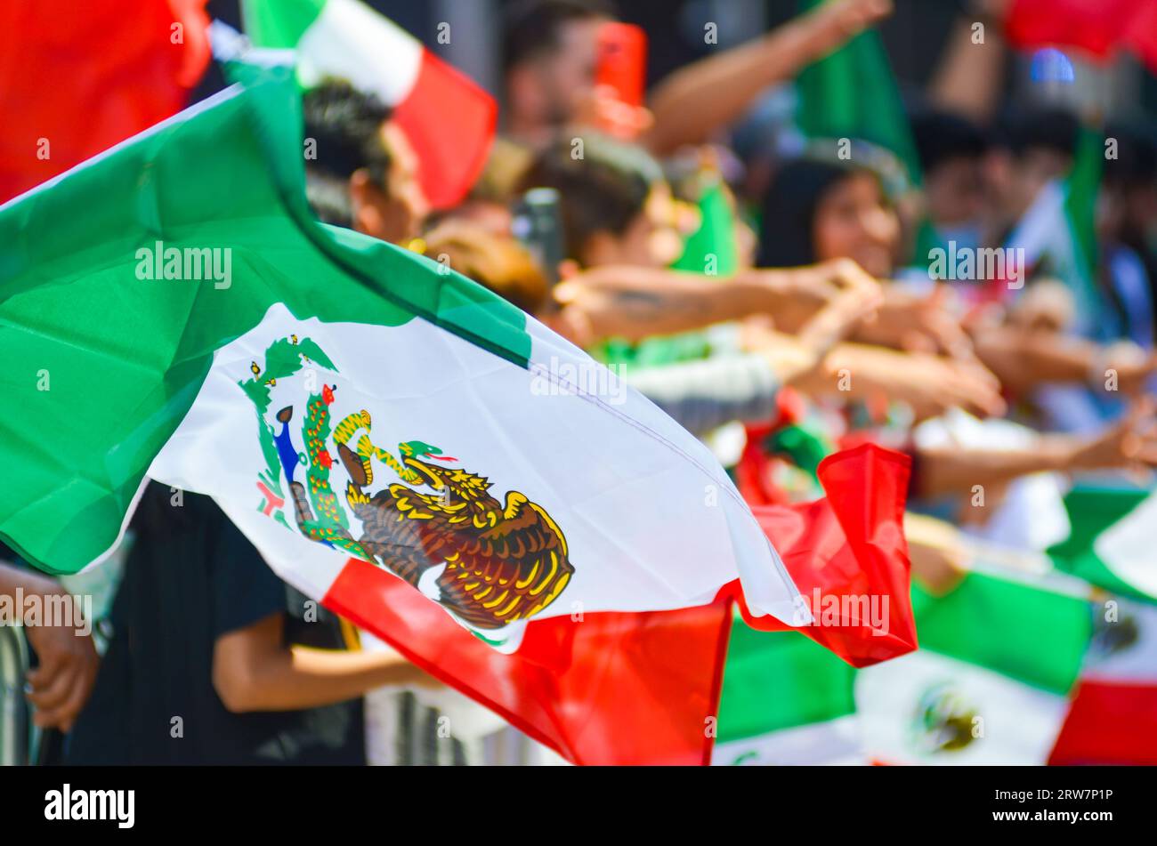 Immigrant crowd waving american flag hi-res stock photography and ...
