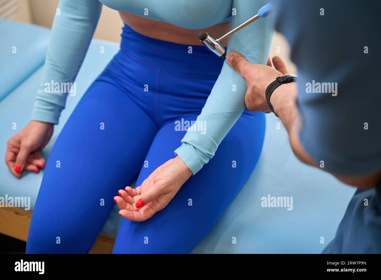 Close-up male neurologist checking female patient physiological ...
