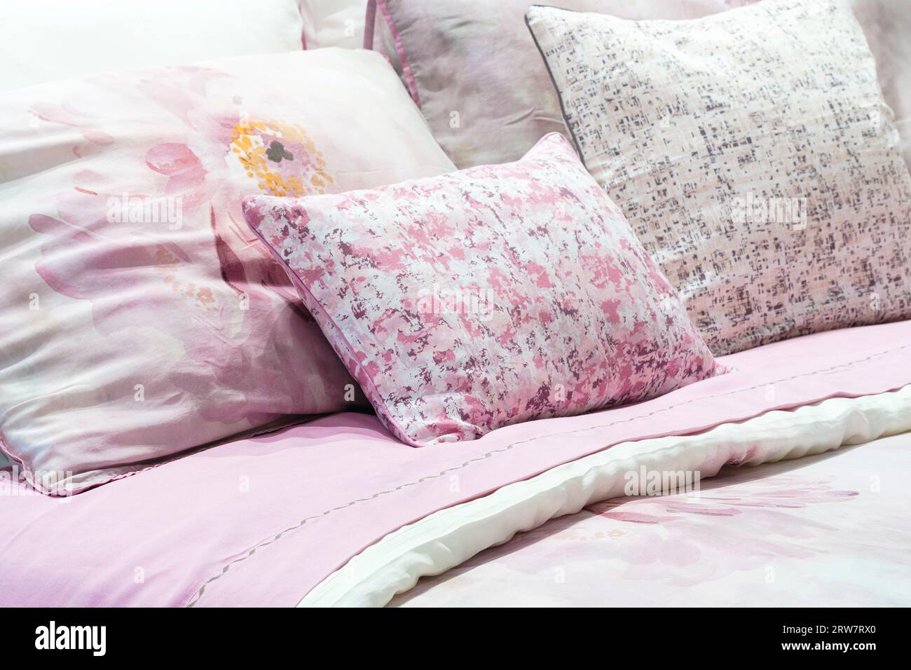 Stylish interior of contemporary room with comfortable bed in pink ...
