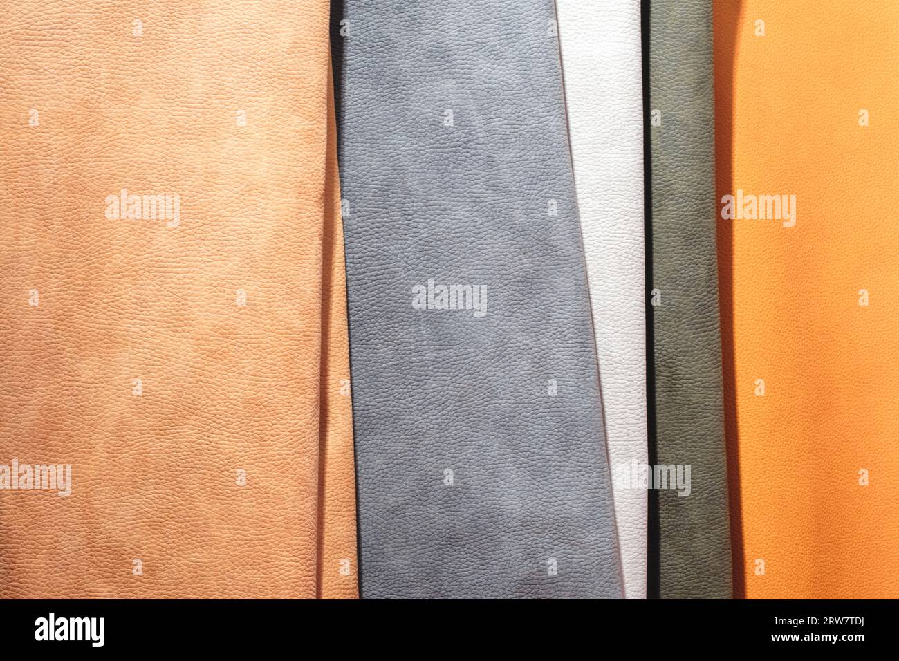 Mix colorful hanging vertical stripe leather on the rack. Texture of ...