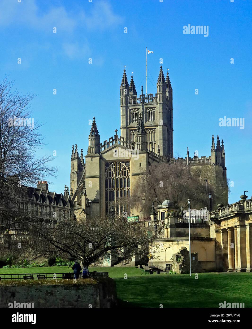 Bath Abbey from across the River Avon with blue sky, City of Bath ...