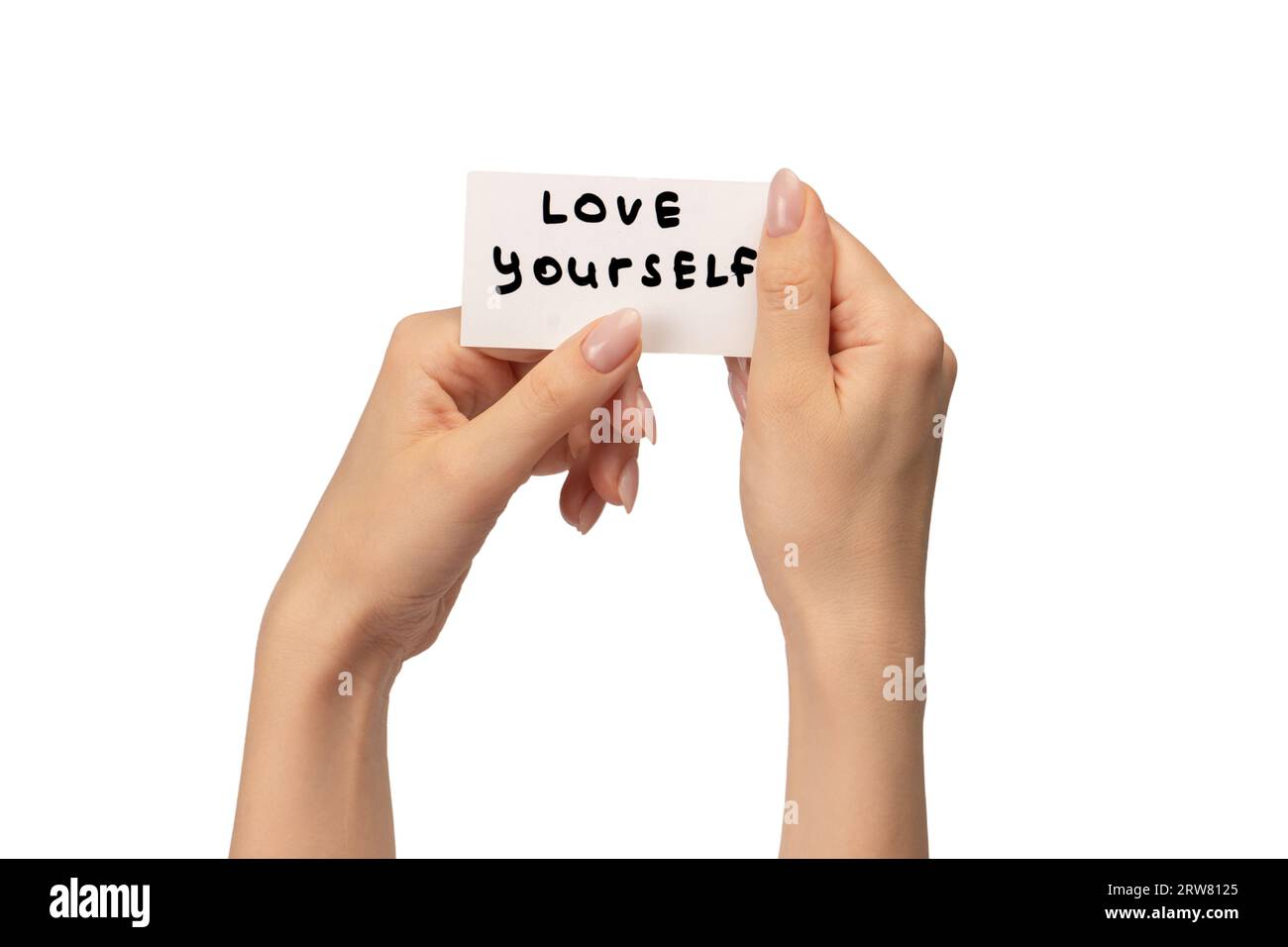 Love yourself text on a card in a woman hand isolated on a white ...