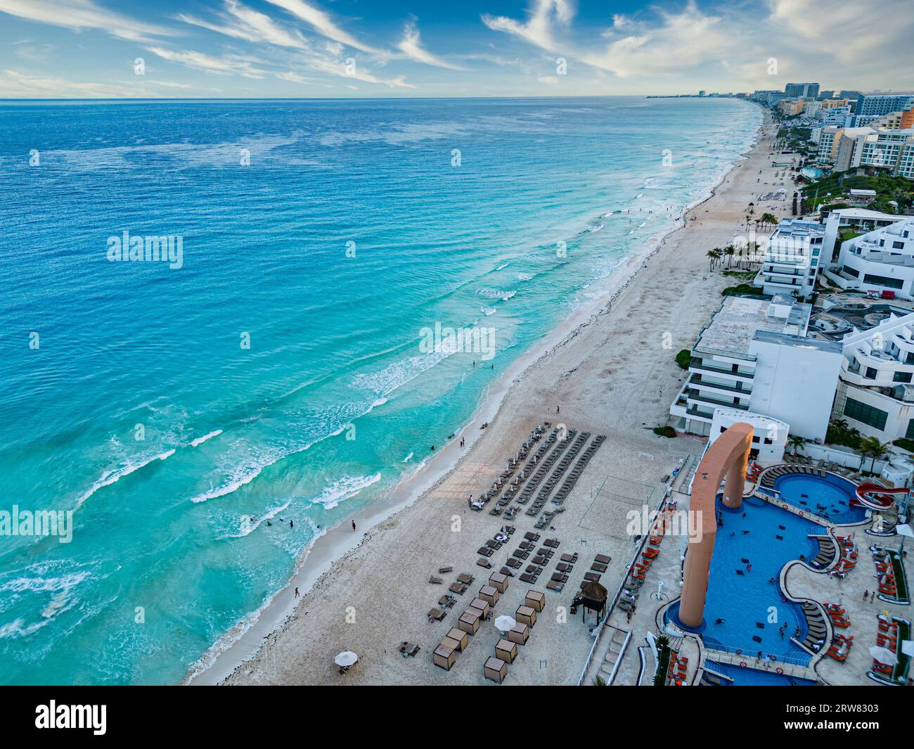 Embrace the vivid daylight panorama of Cancún's pristine beaches. The ...