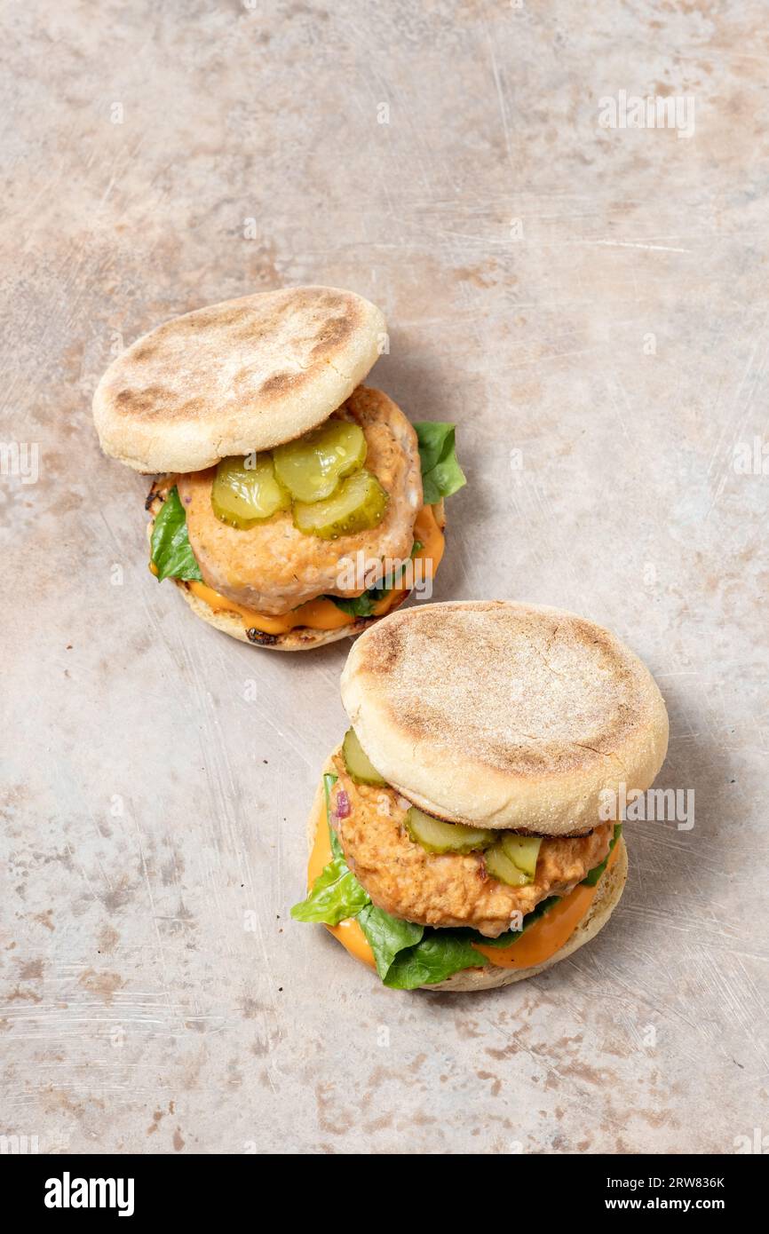Salmon fishburger on english muffin Stock Photo - Alamy