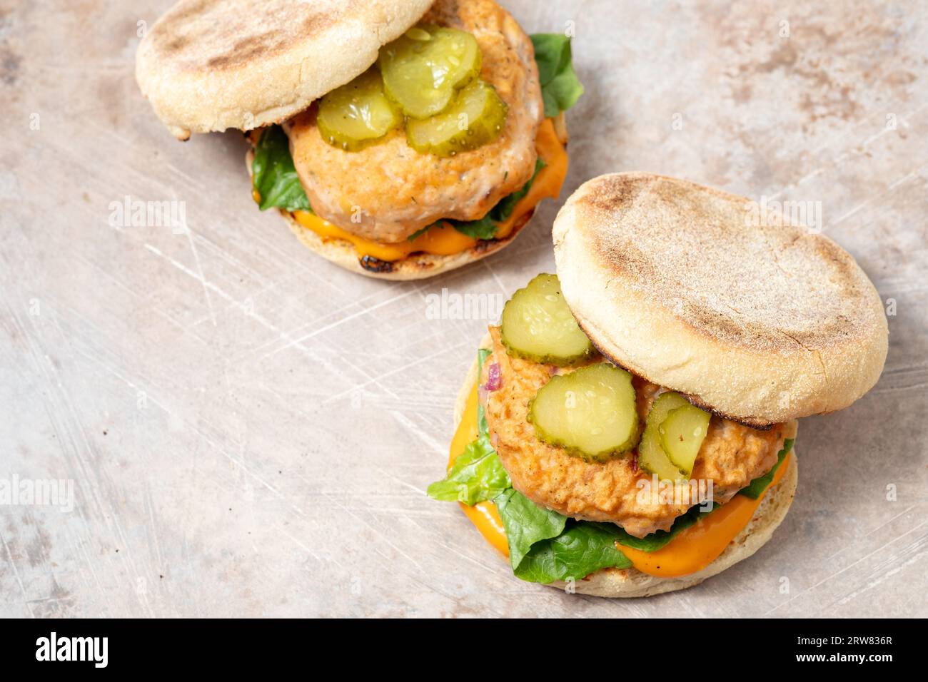Salmon fishburger on english muffin Stock Photo - Alamy