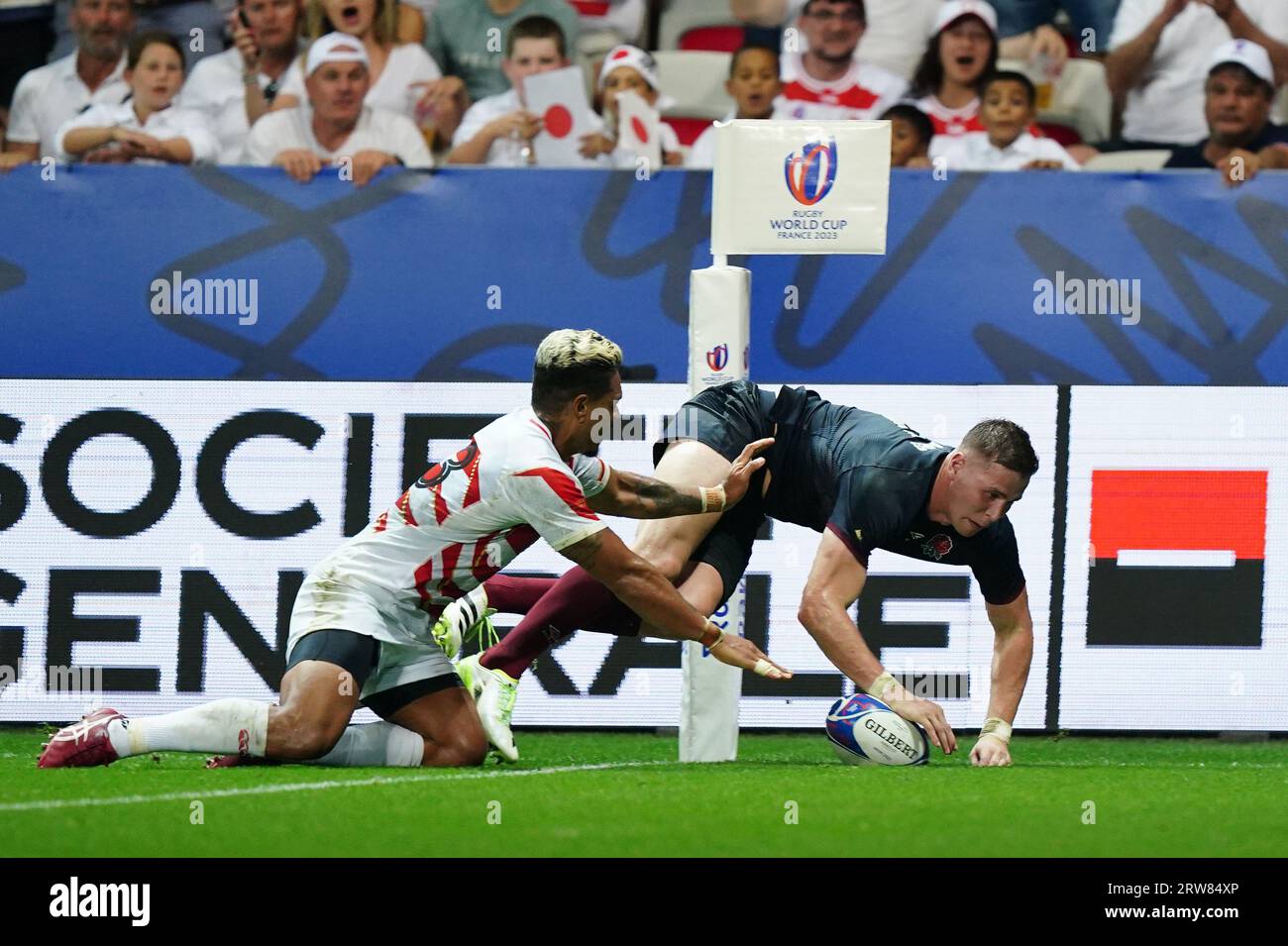 England's Freddie Stewart (right) scores a try during the Rugby World ...