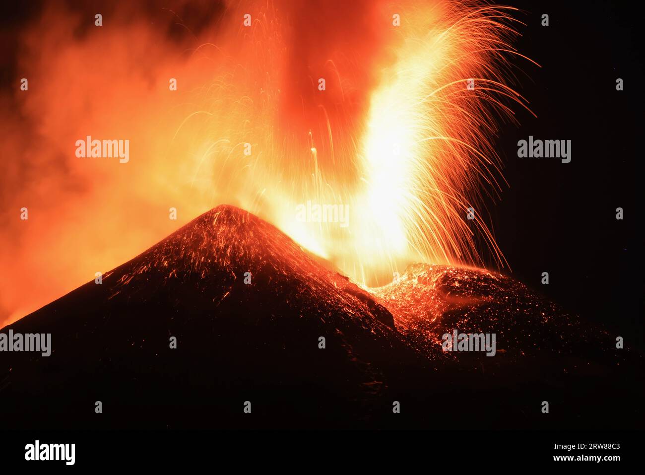 Etna volcano in Sicily - view on crater during a giant lava explosion ...