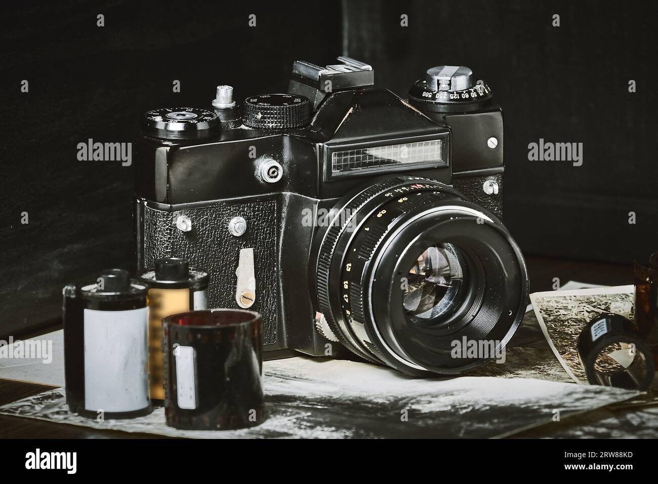 Old vintage camera close up, rolls of film, old photos, tinted shot ...