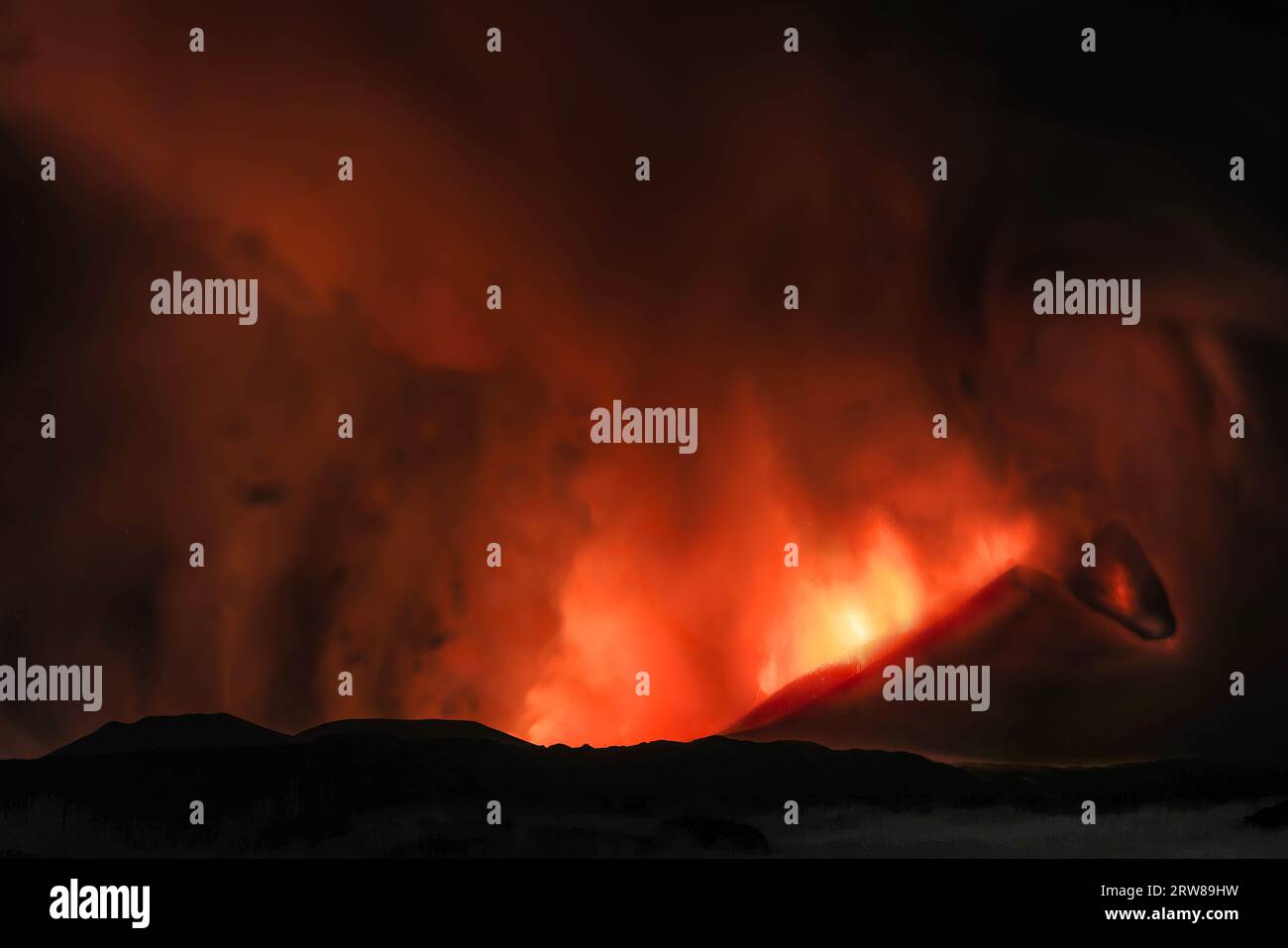 Etna during a suggestive eruption at night from the volcano's crater ...