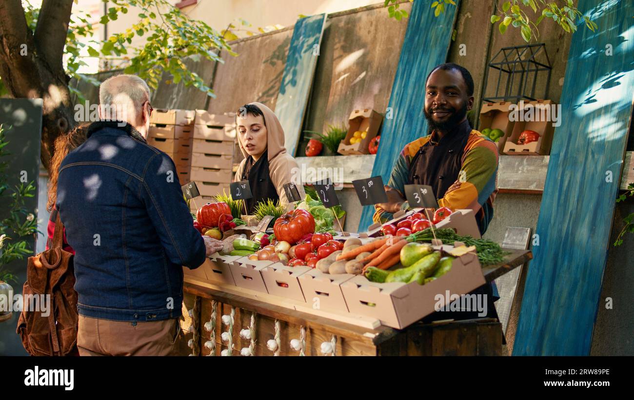 African american farmer presenting box hi-res stock photography and ...