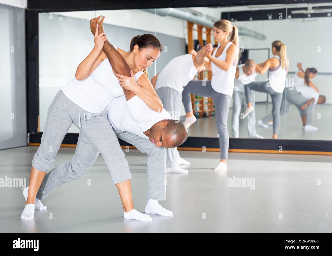 Woman doing strength techniques in self defense training Stock Photo ...