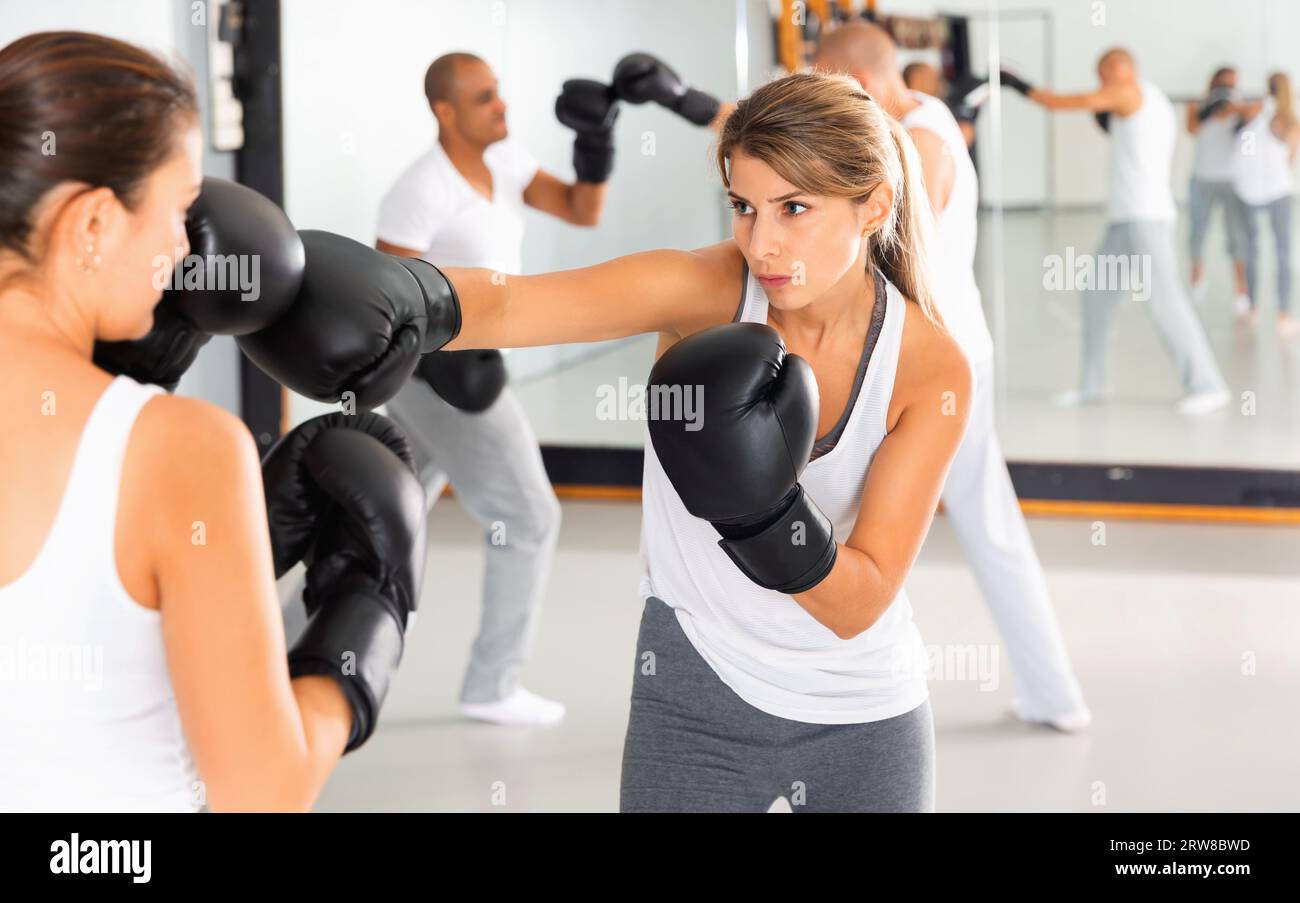 Two women boxing sparring in the gym Stock Photo - Alamy