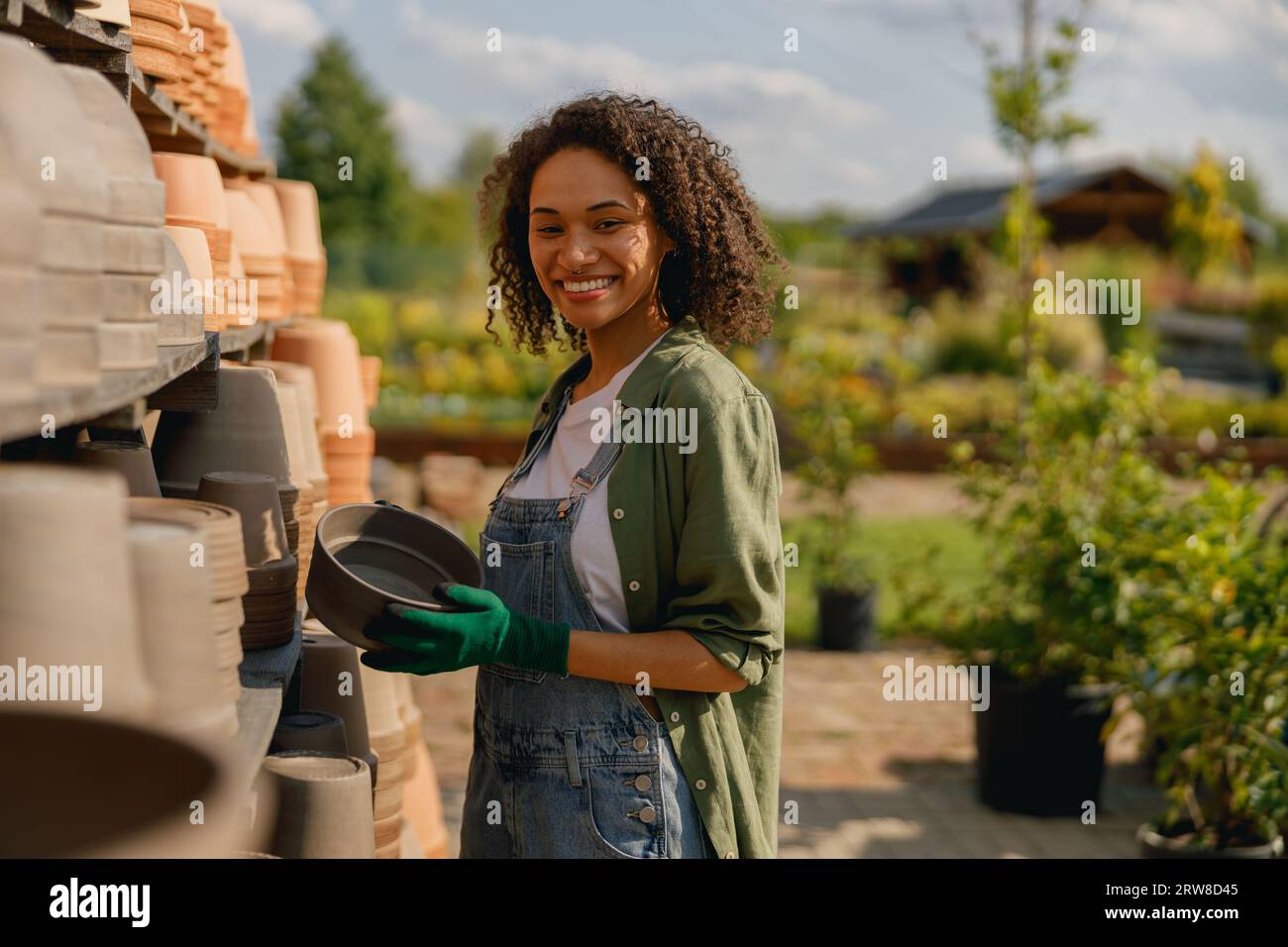 Woman standing near racks hi-res stock photography and images - Alamy
