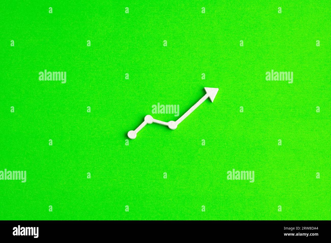 White statistics arrow pointing up on green color background - Growth ...