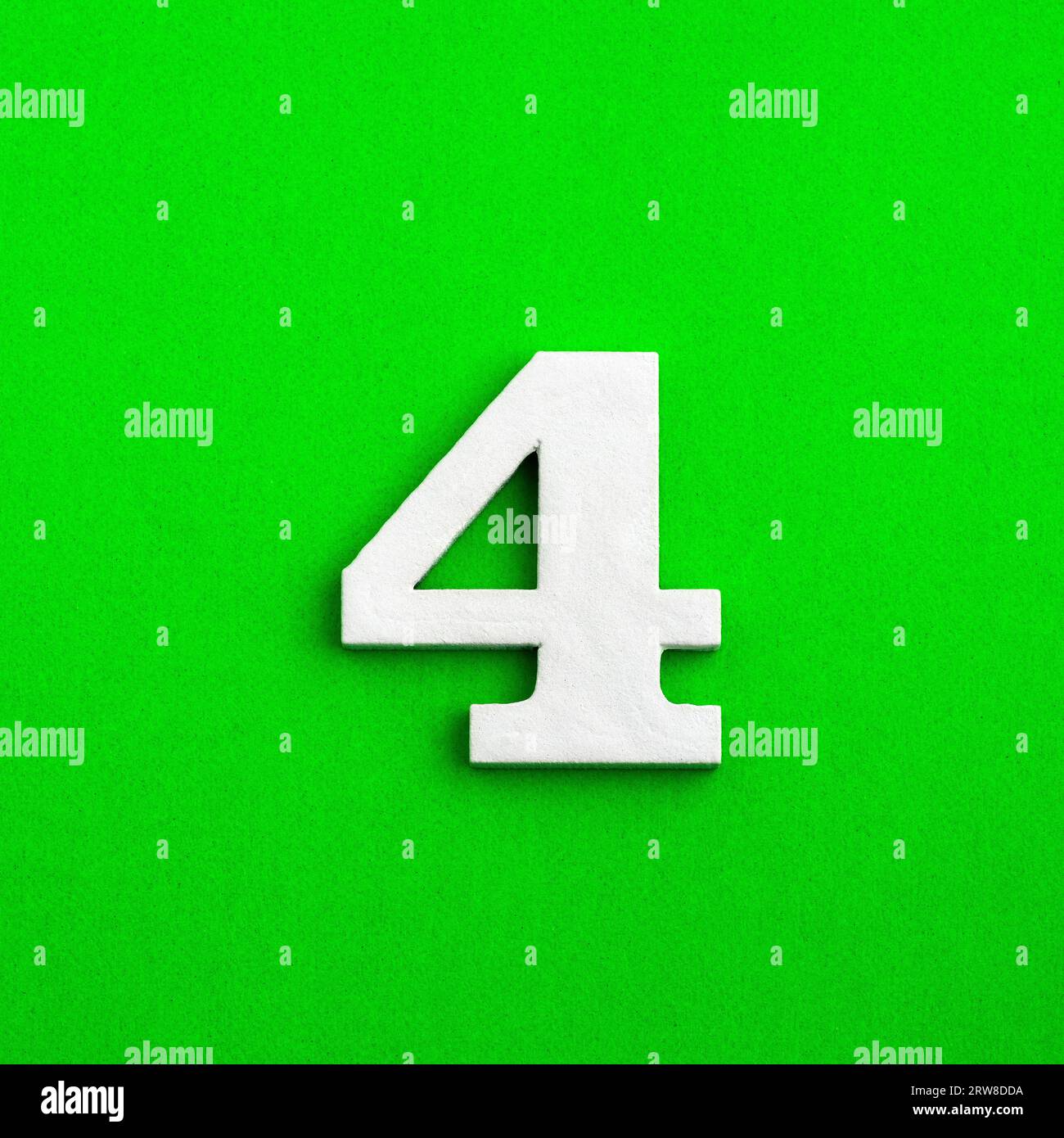 Number 4 - White wooden number on green background Stock Photo - Alamy