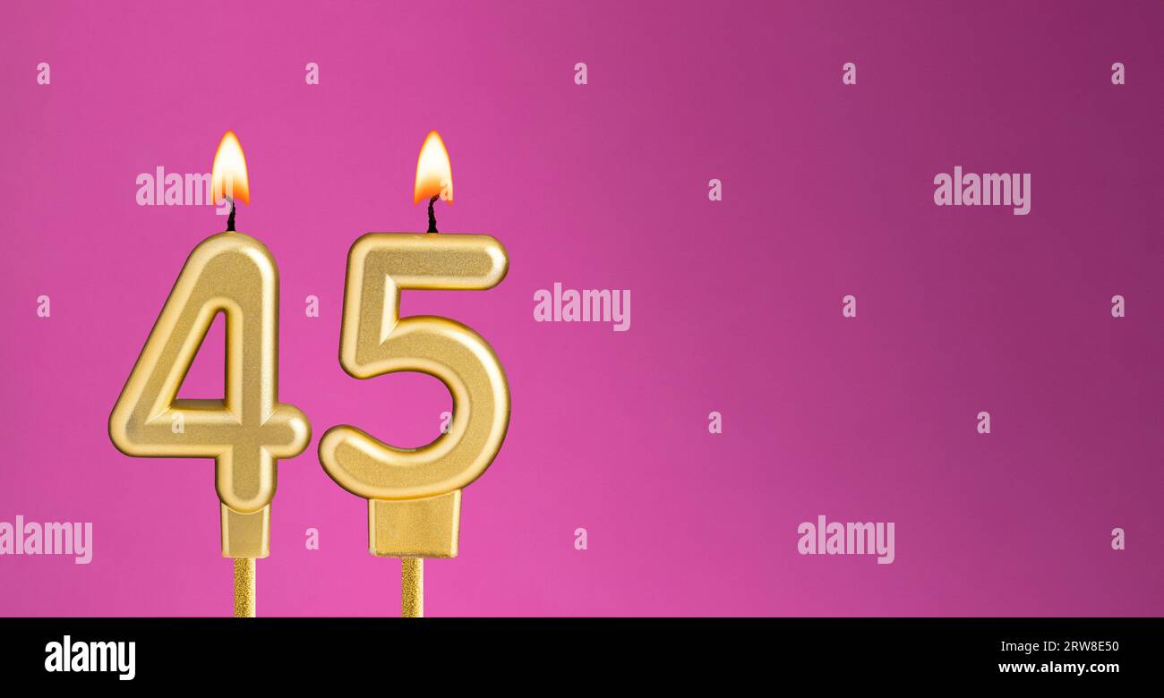Candle number 45 in purple background - birthday card Stock Photo - Alamy