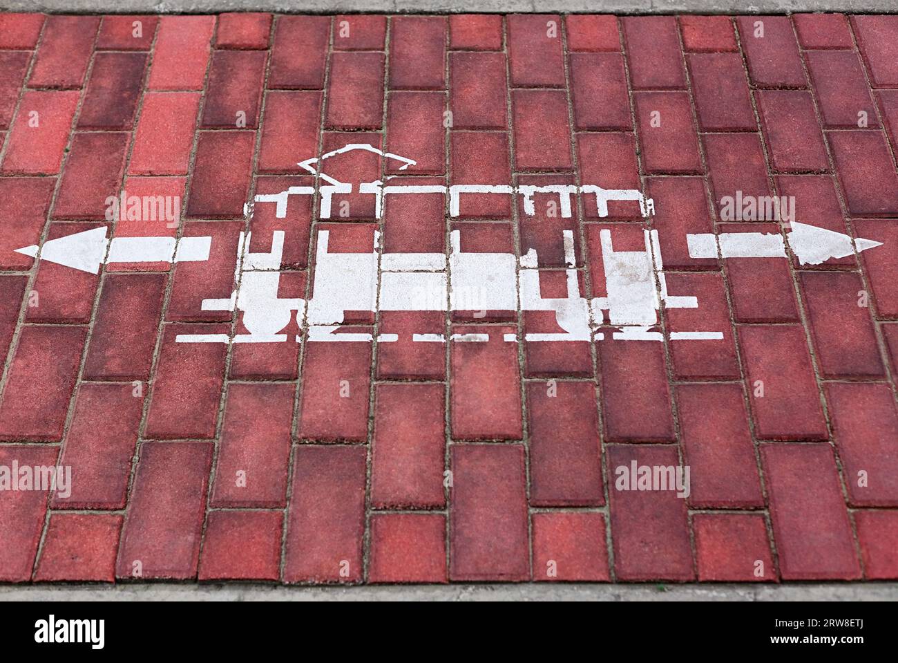 Tram marking pictogram symbol on cobbles pavement for passengers ...