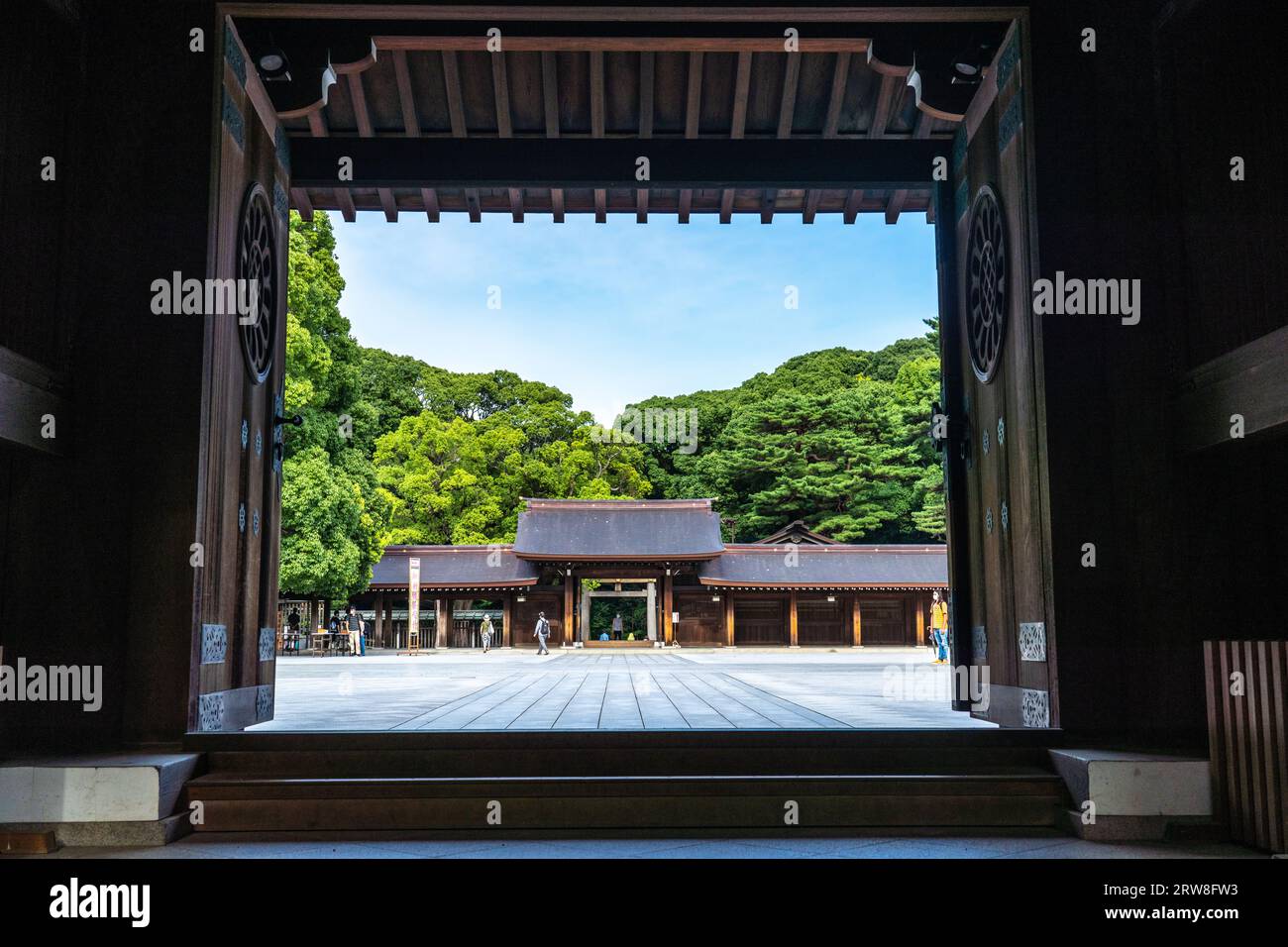 The massive wooden doors looking out at the Tamagaki sacred fence and ...